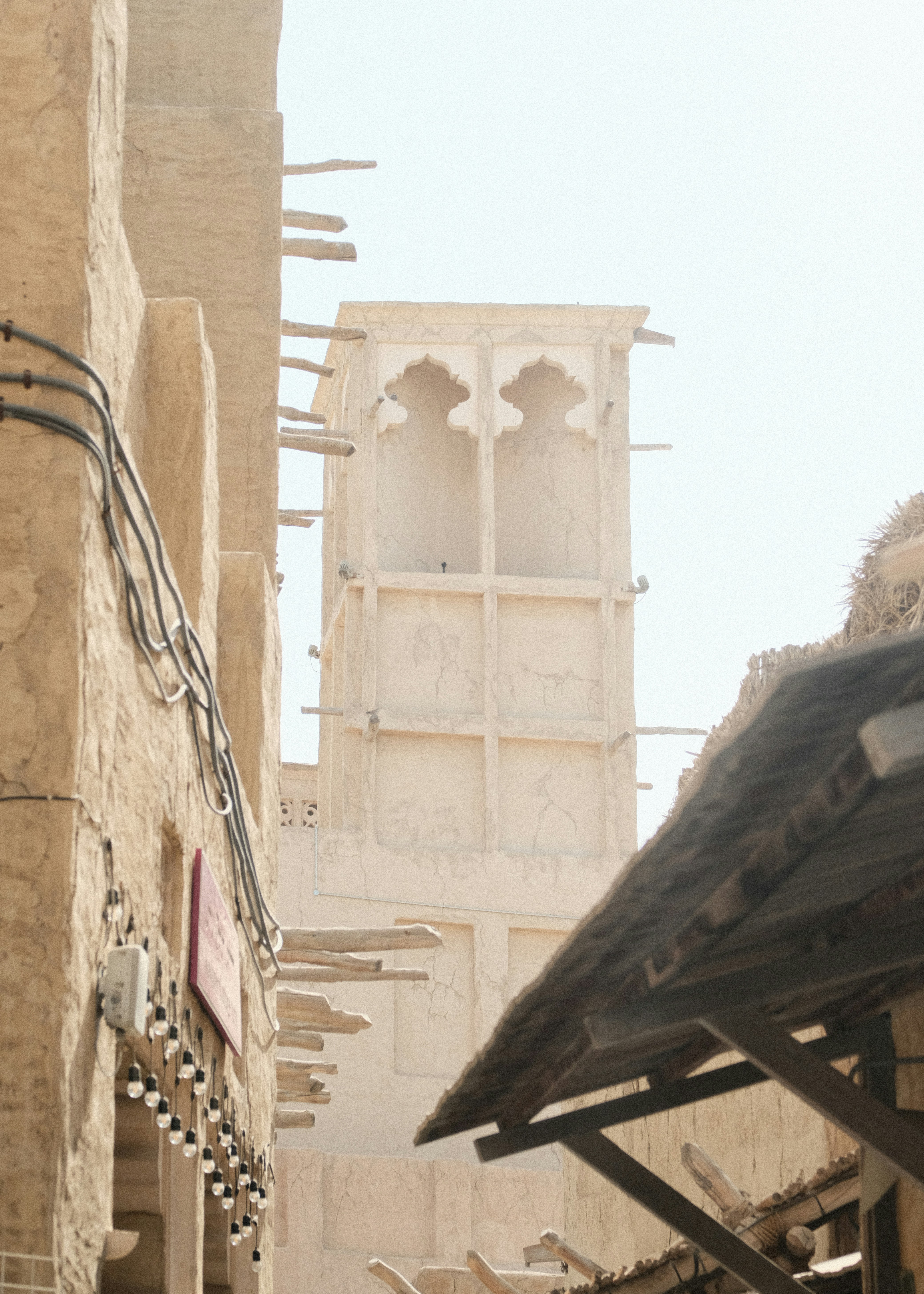 Wind-Catcher in a Sun-Bleached Sandstone Alley