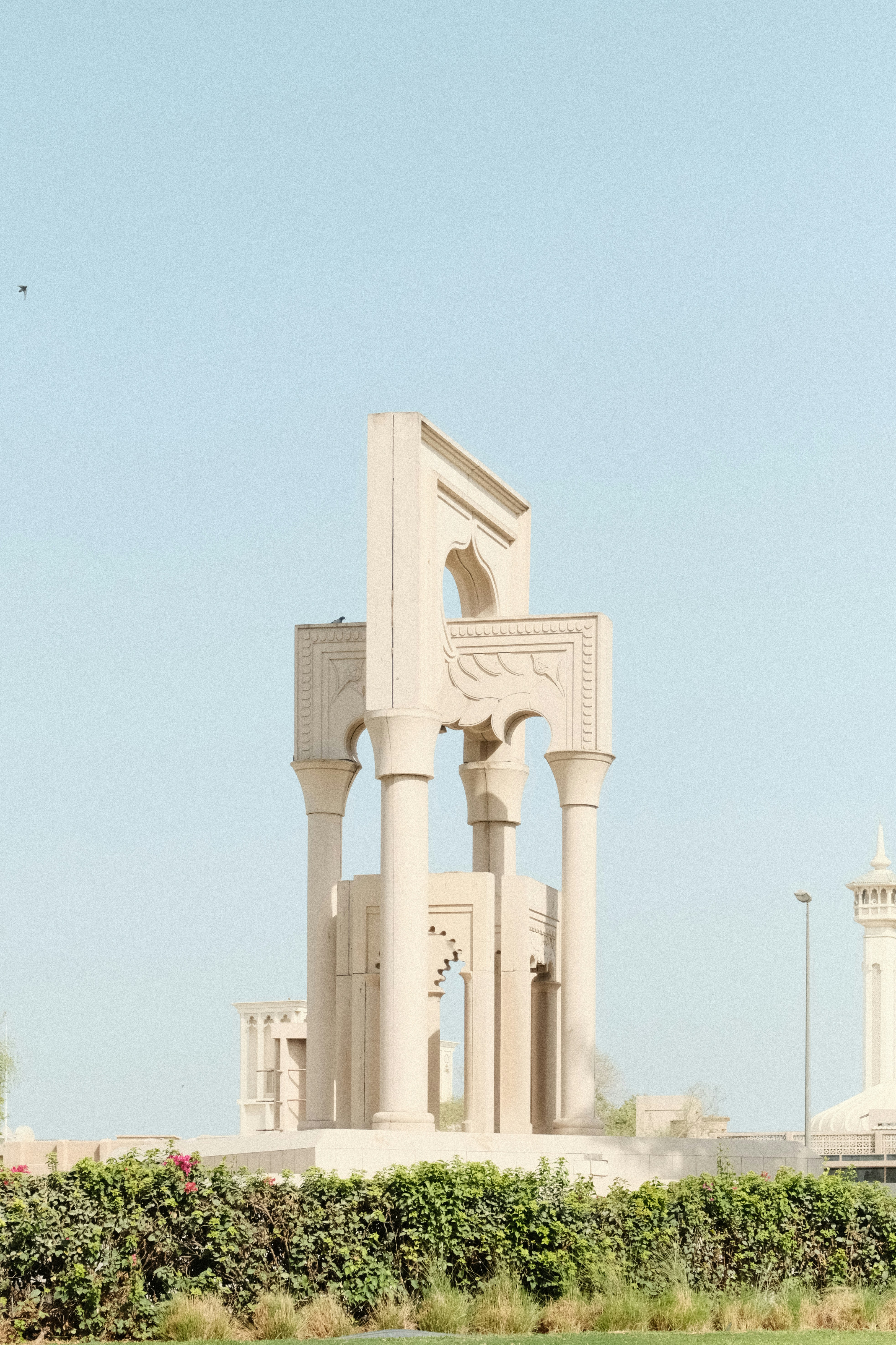 Modern architectural structure against a clear blue sky
