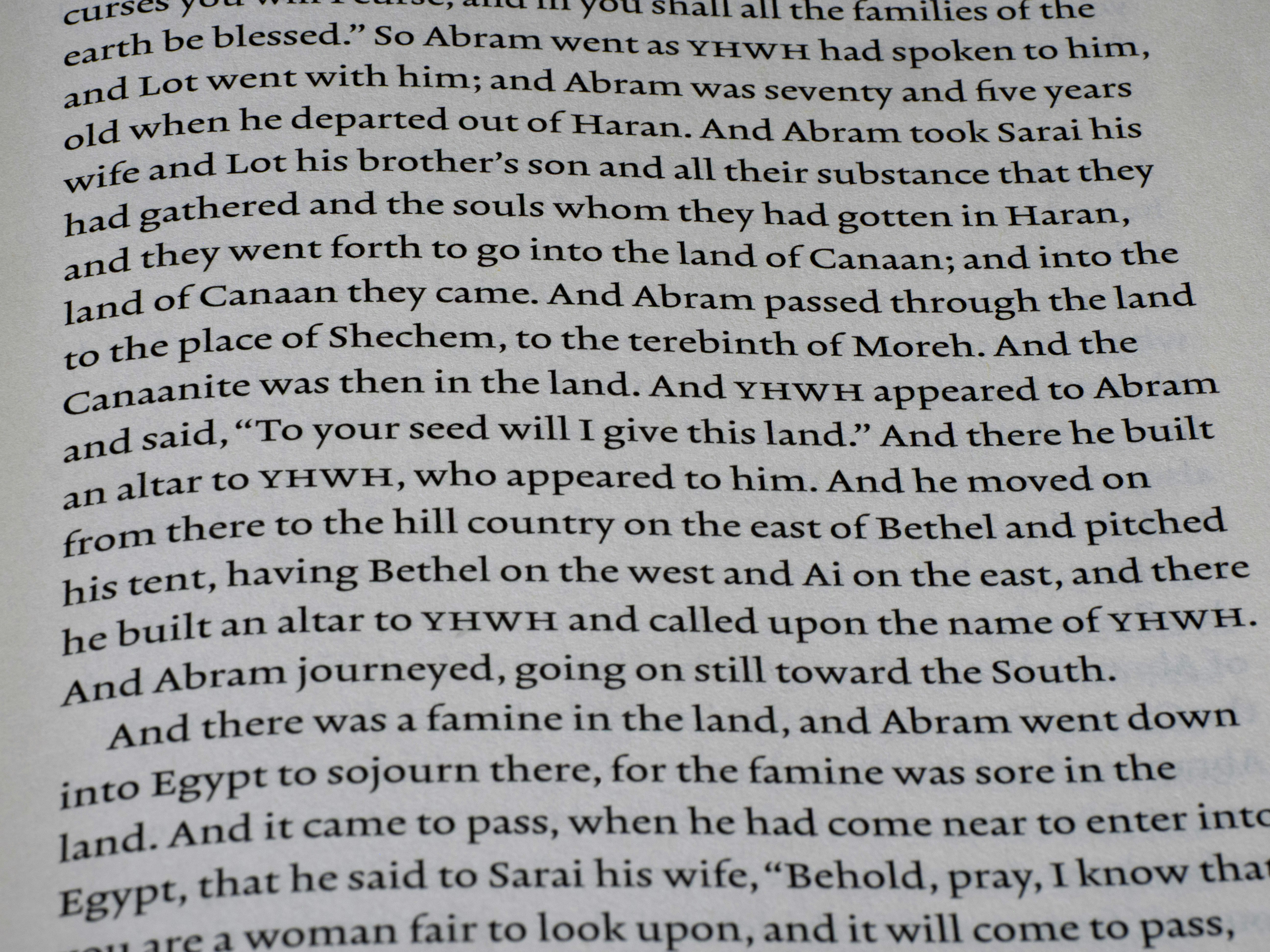 The Book of Genesis | Close-up of an open book with text.