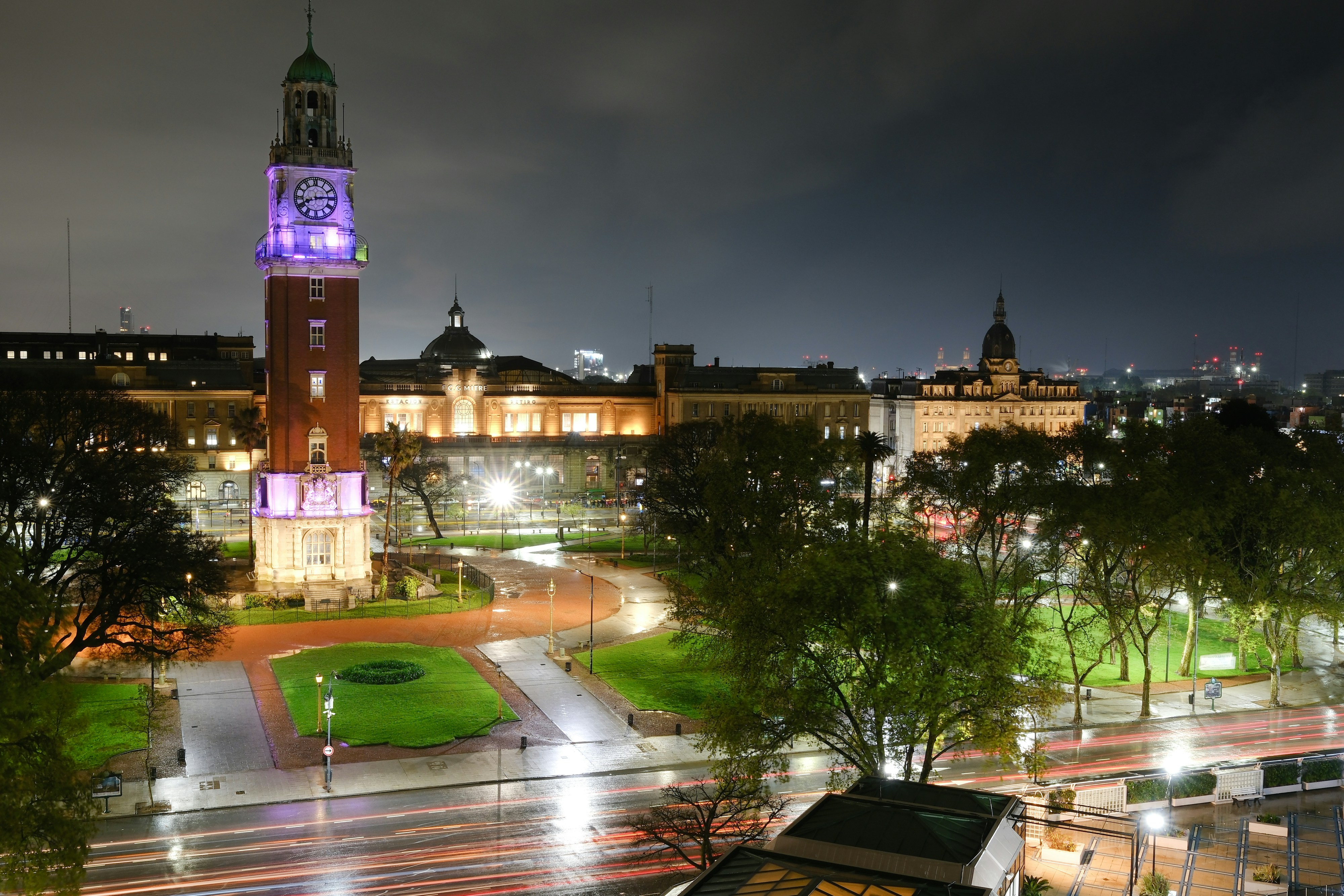 City park with illuminated tower at night