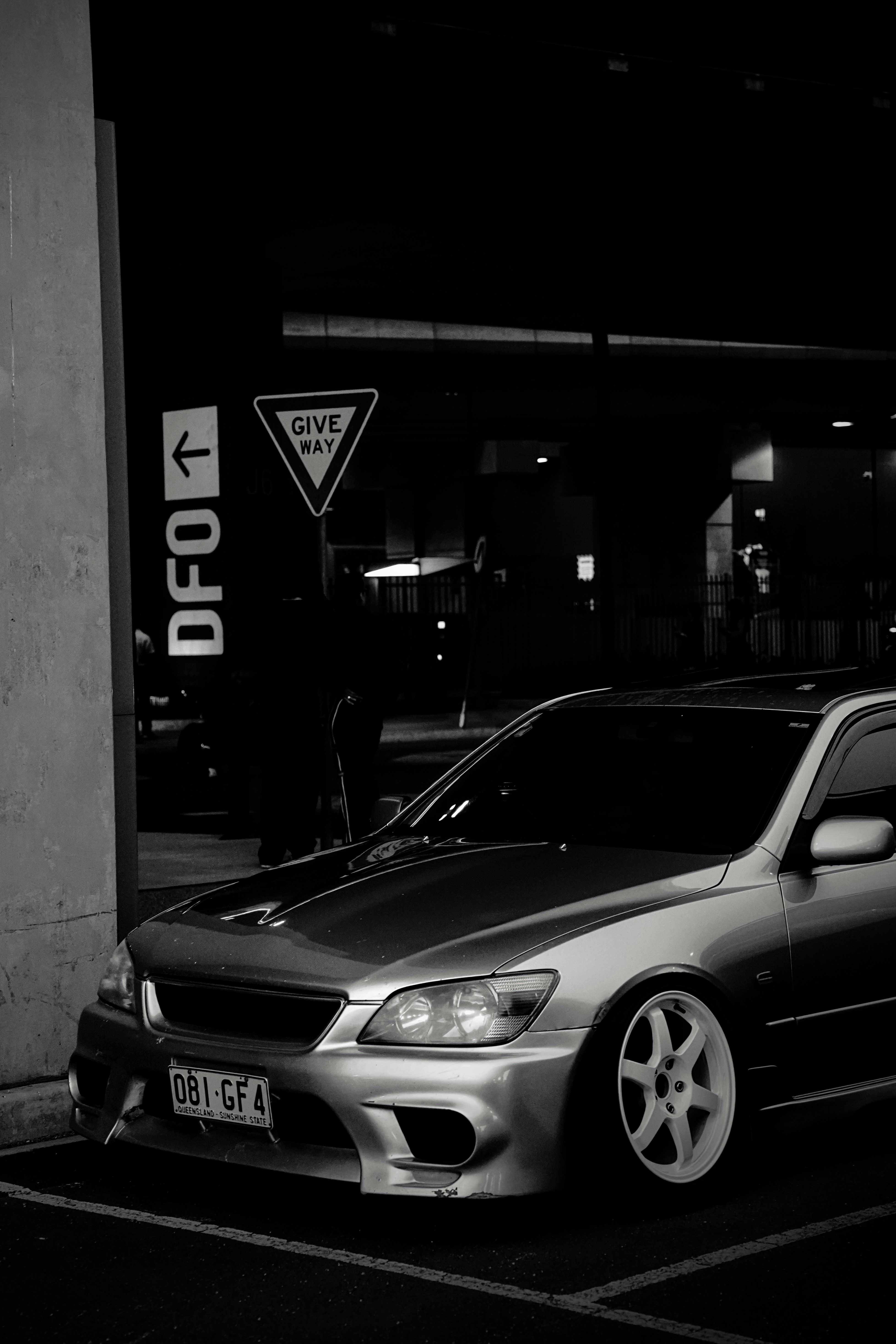 Urban Elegance: A Silver Sedan in Monochrome