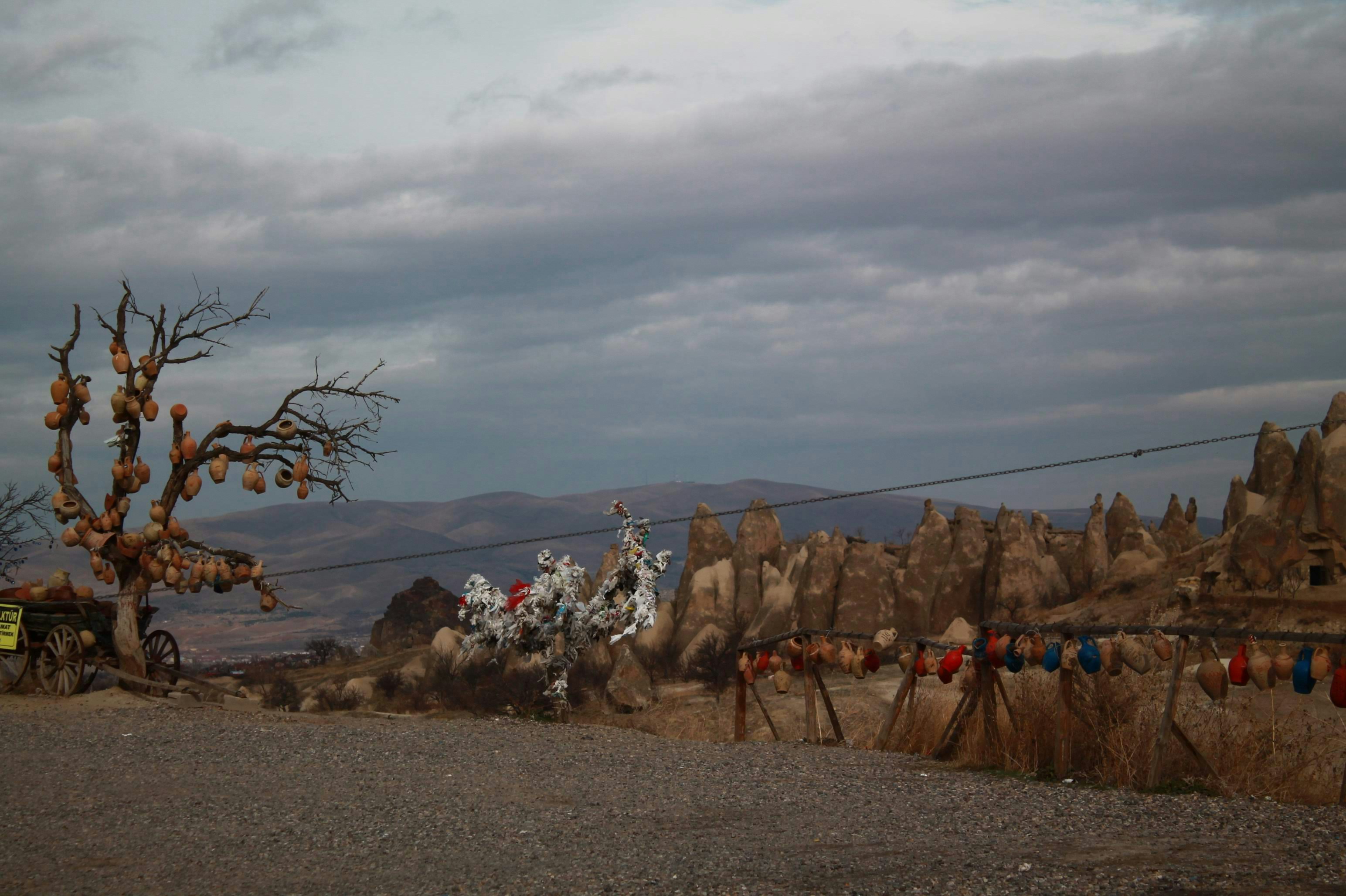 Rocky landscape with decorative trees and hanging ornaments.