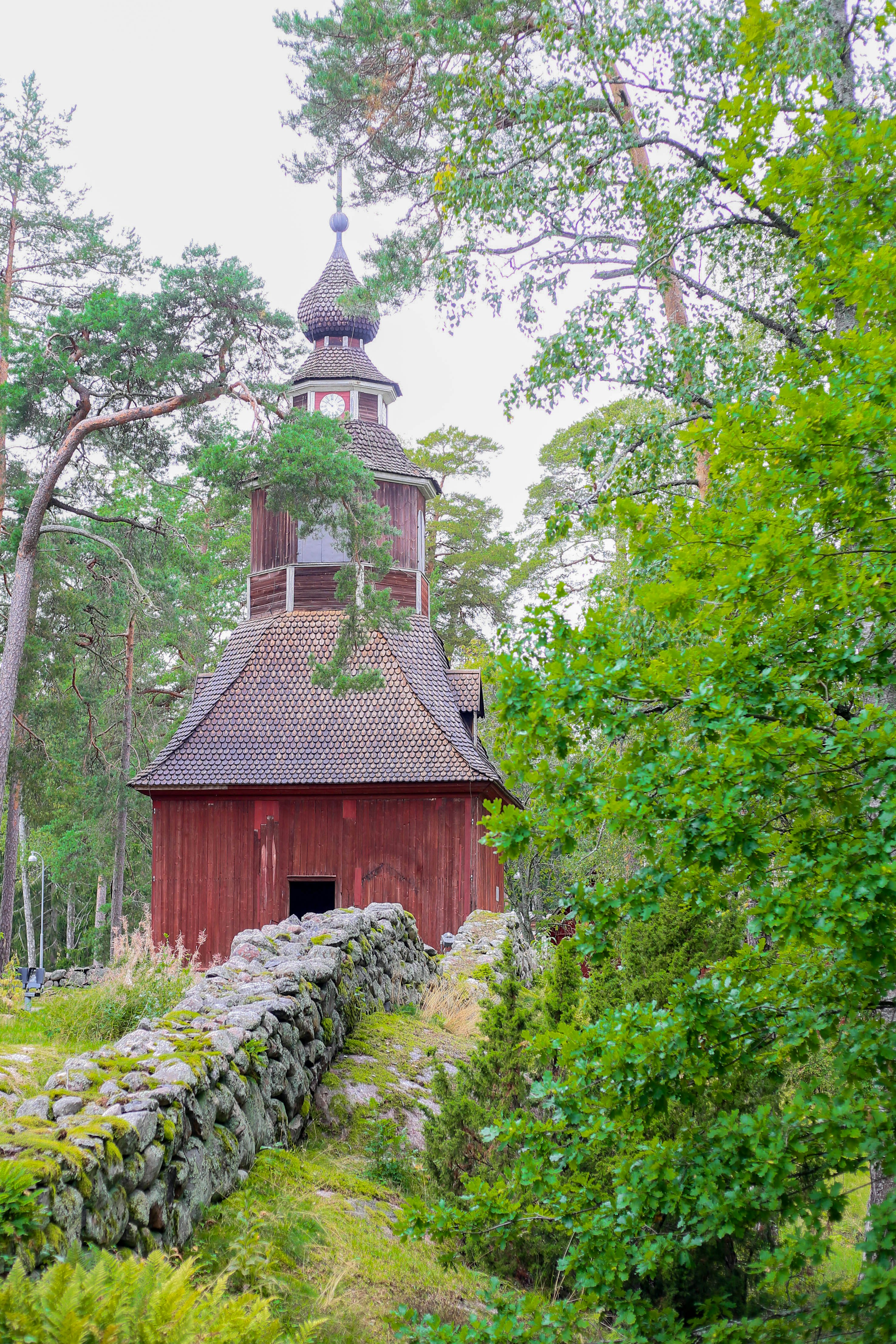 Whispering Timber Chapel Beyond the Moss-veiled Wall