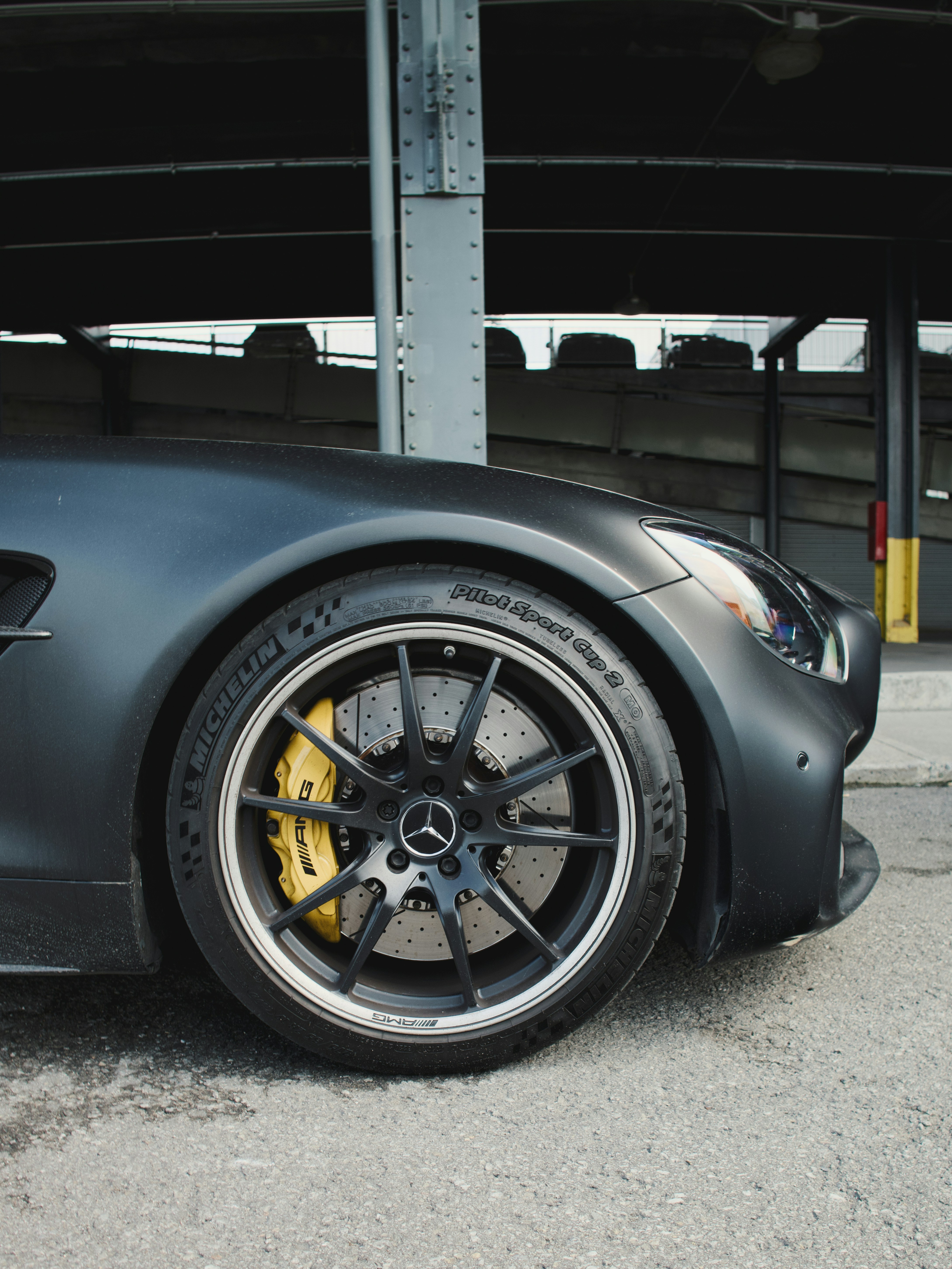Close-up of a matte black sports car wheel