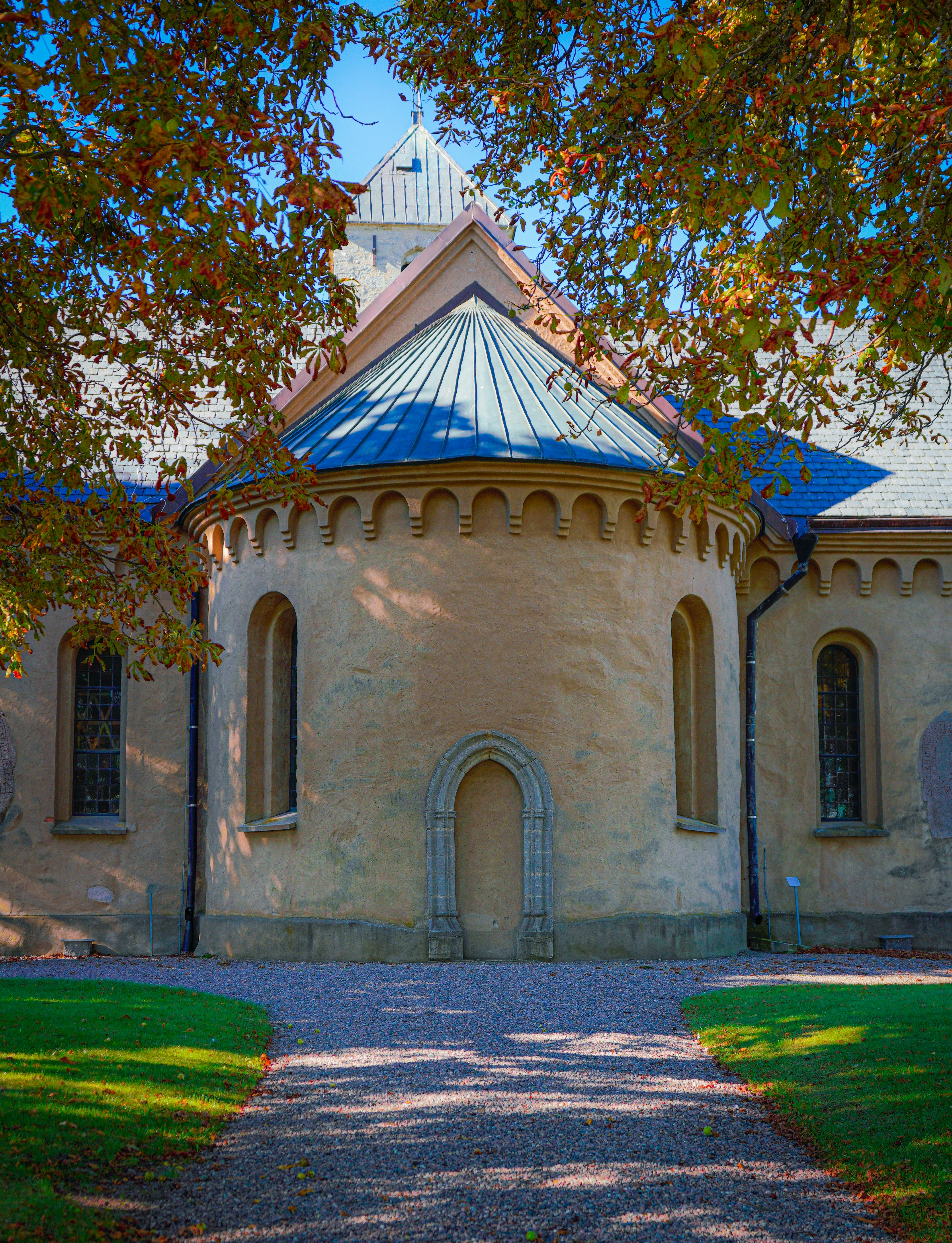 Autumn Light Framing a Round Turreted Chapel
