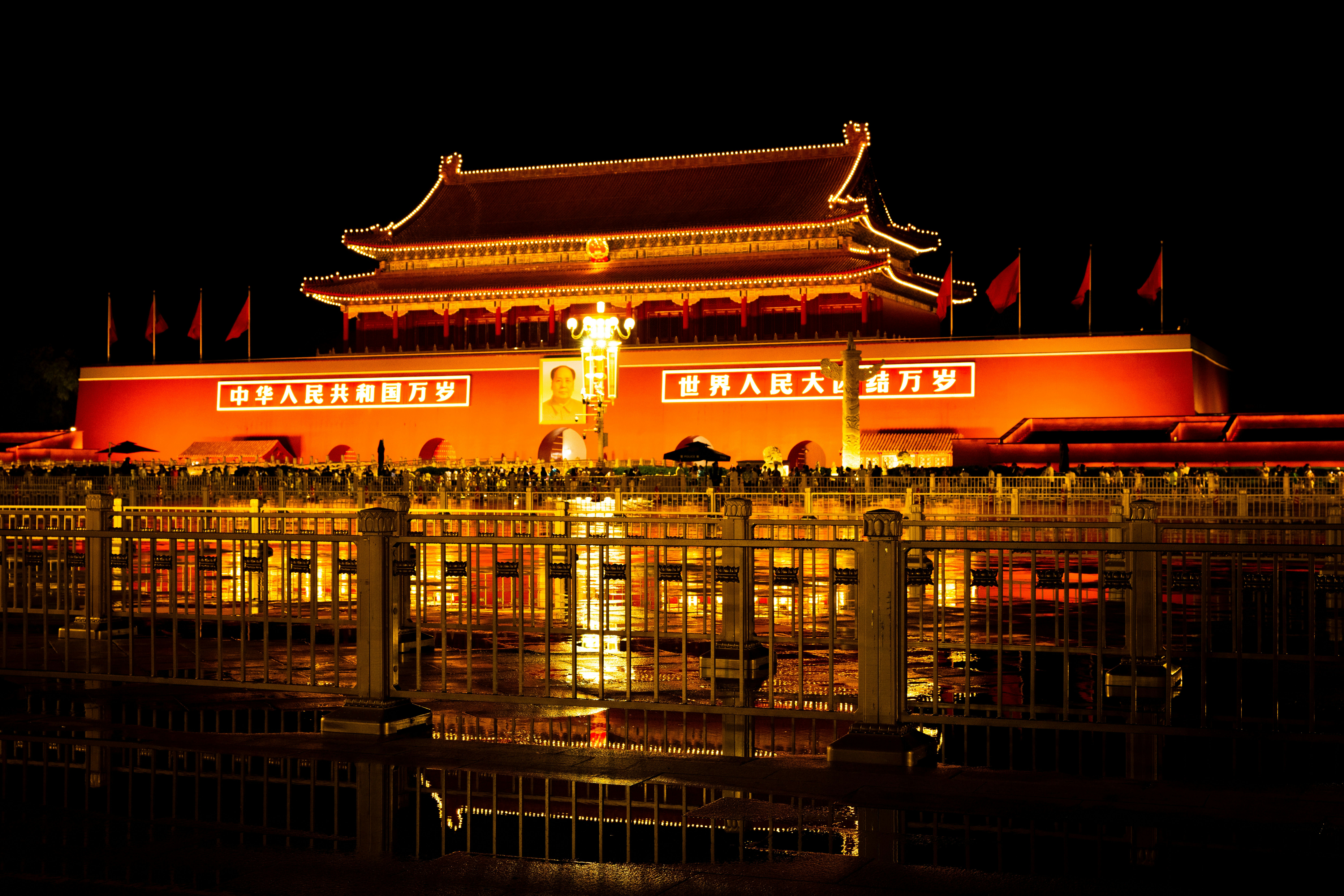 Illuminated tiananmen gate at night with reflections