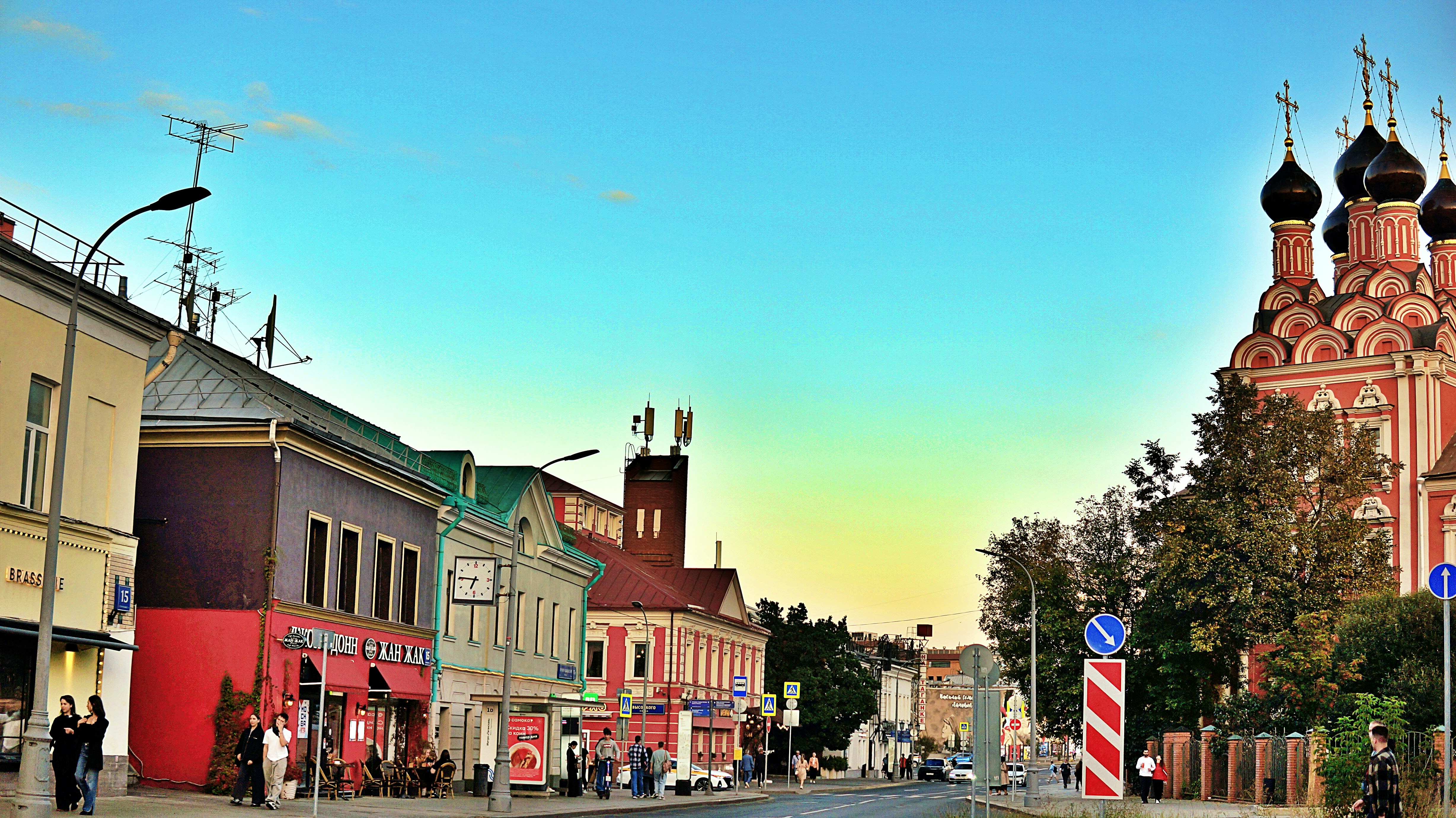 Golden Hour Along a Colorful Street Leading to a Russian Orthodox Church
