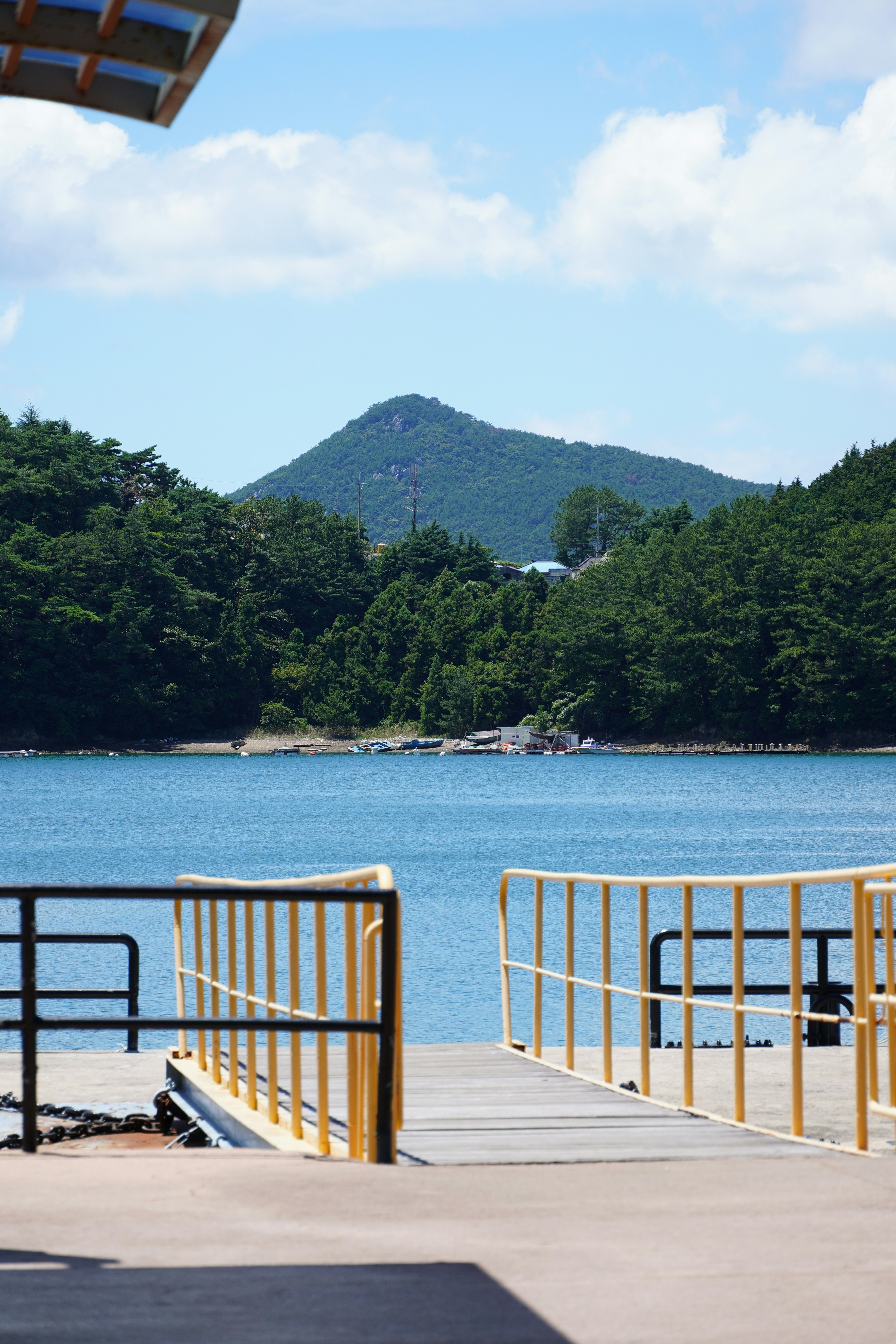Gateway to Blue Lake: Pier Framing a Forested Peak