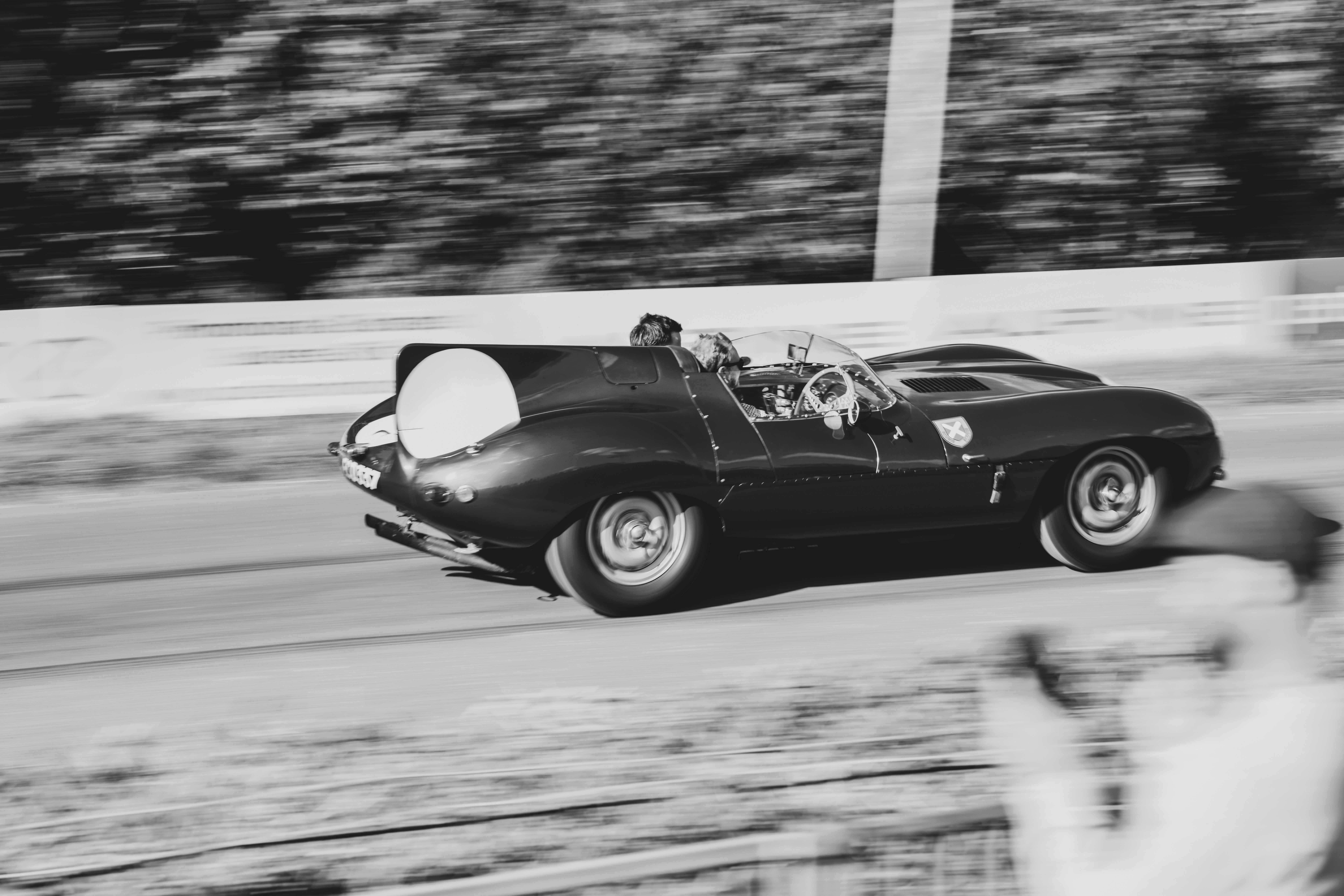 Velocity in Velvet: a vintage roadster tearing through motion blur
