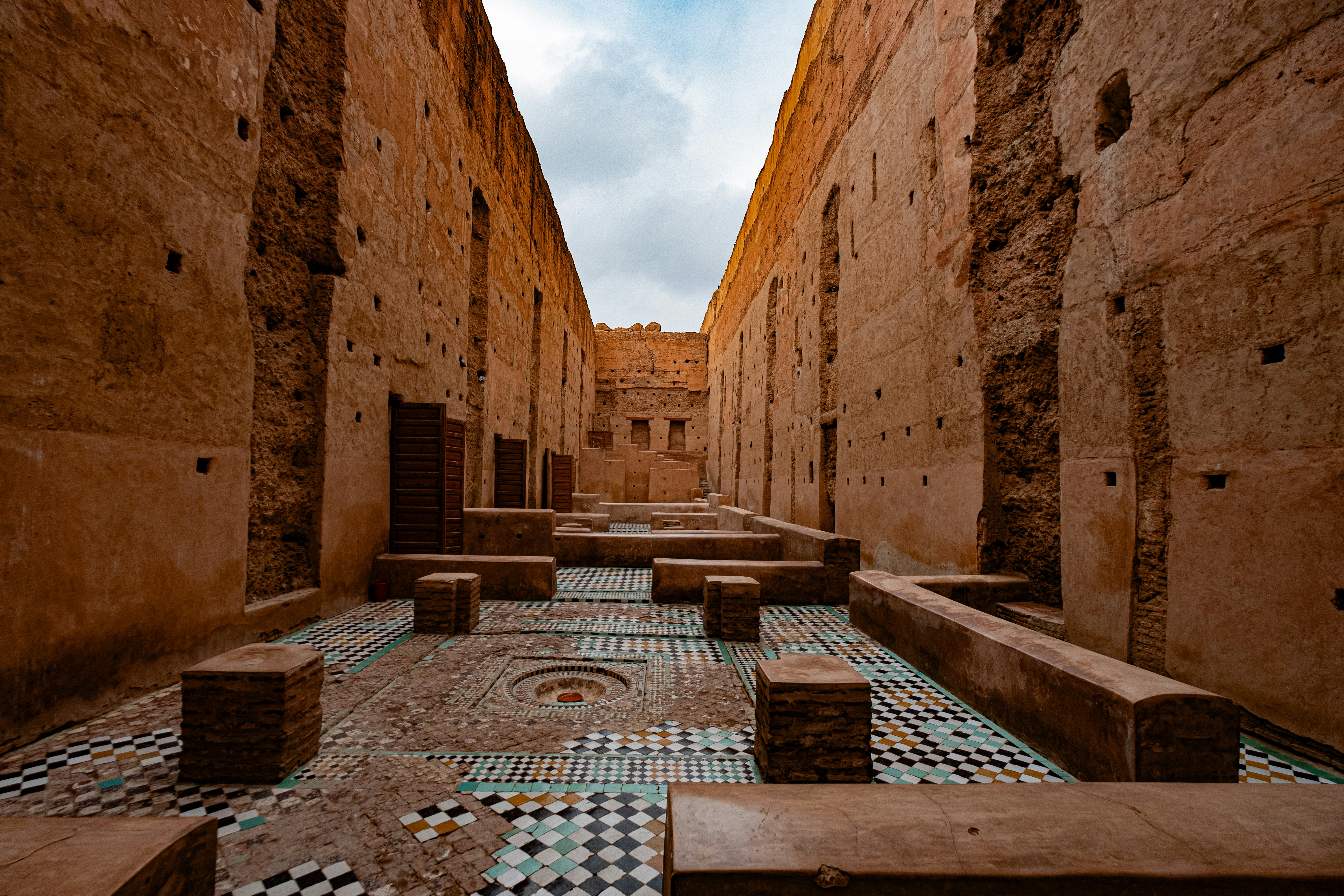 Ancient ruins with patterned floor and stone walls