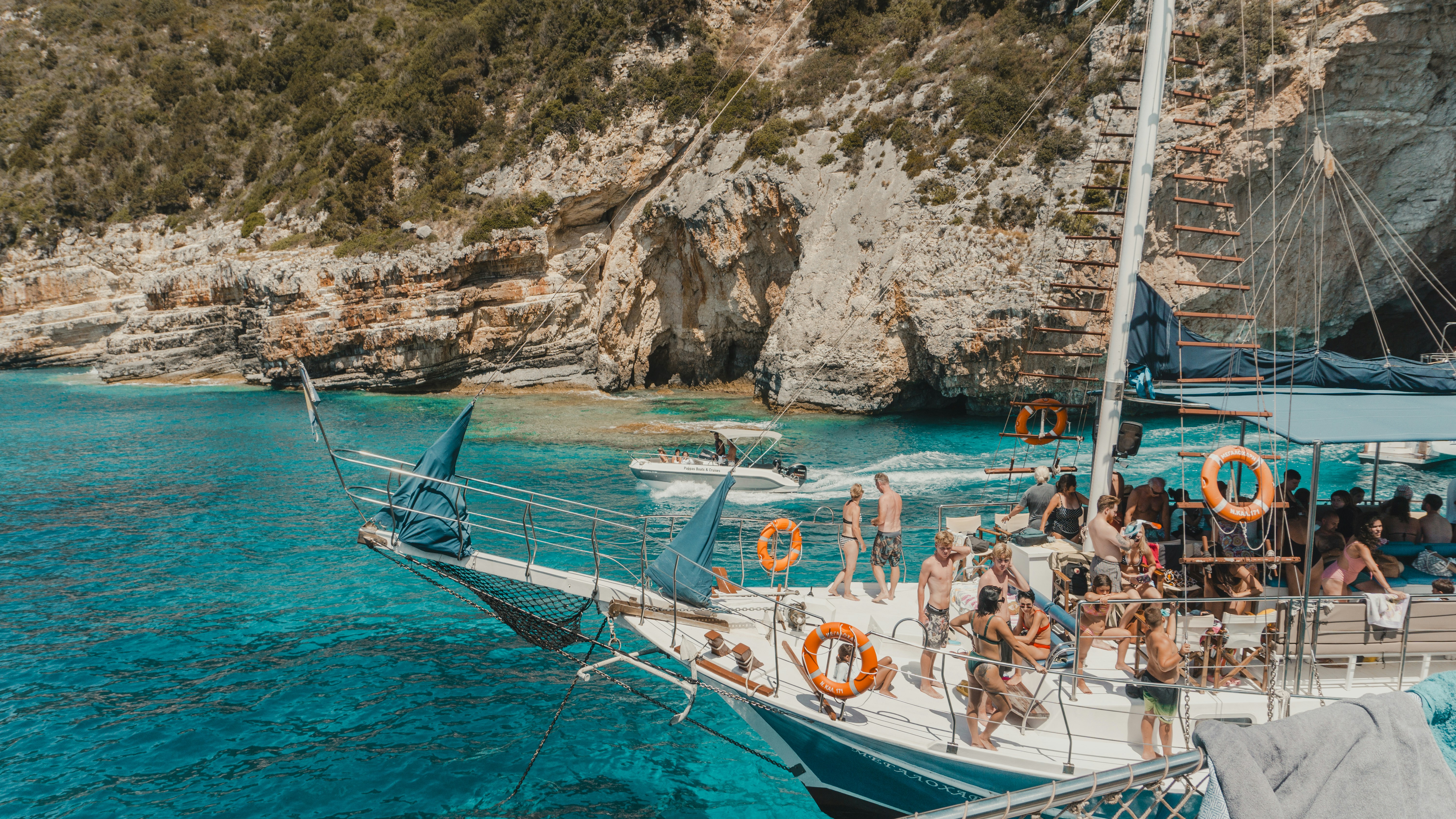 Turquoise Cove Sails: a Sunlit Sailboat Packed with Vacationers