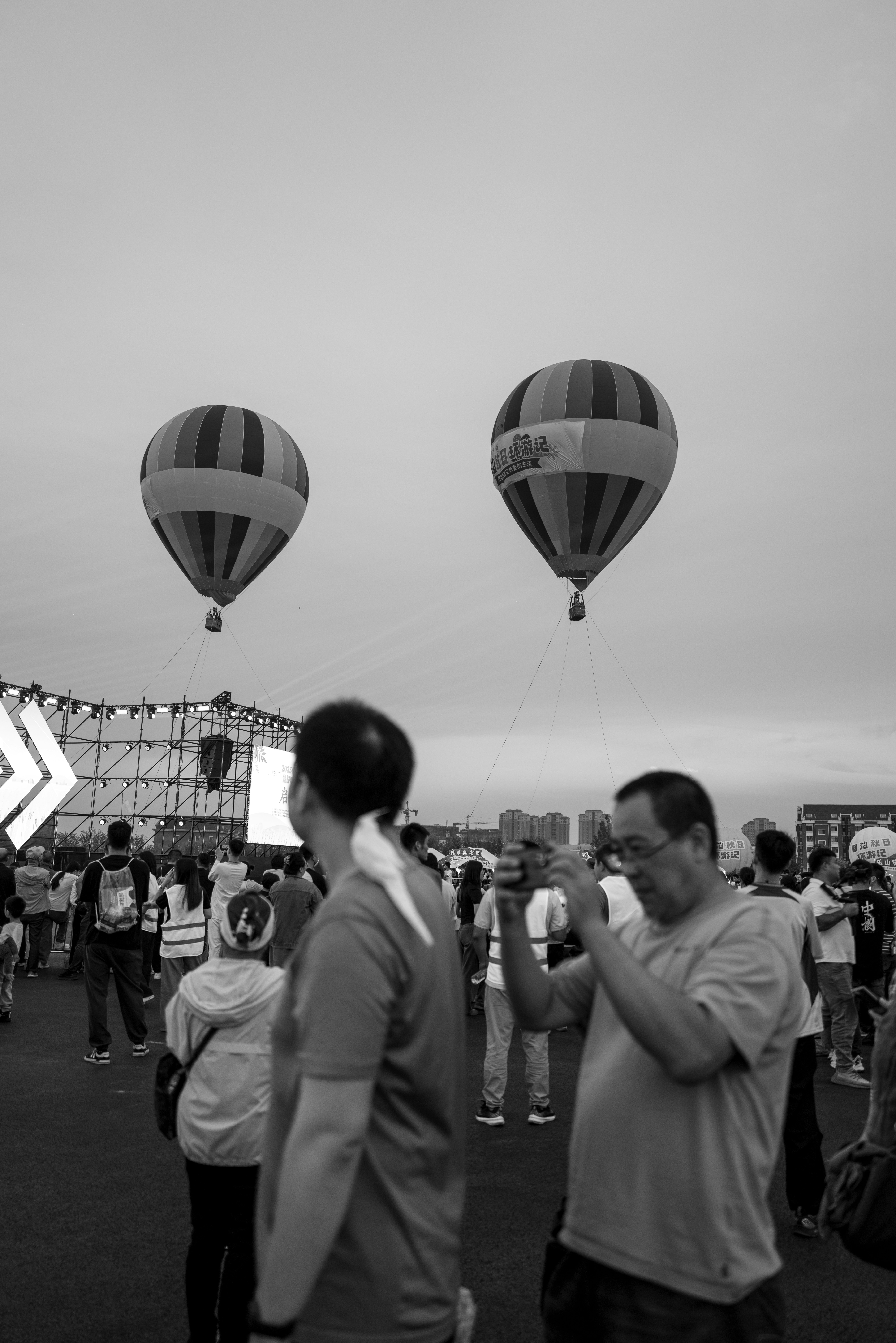 Hot-Air Ballet Over the Crowd: Balloons and Breathless Cityscape