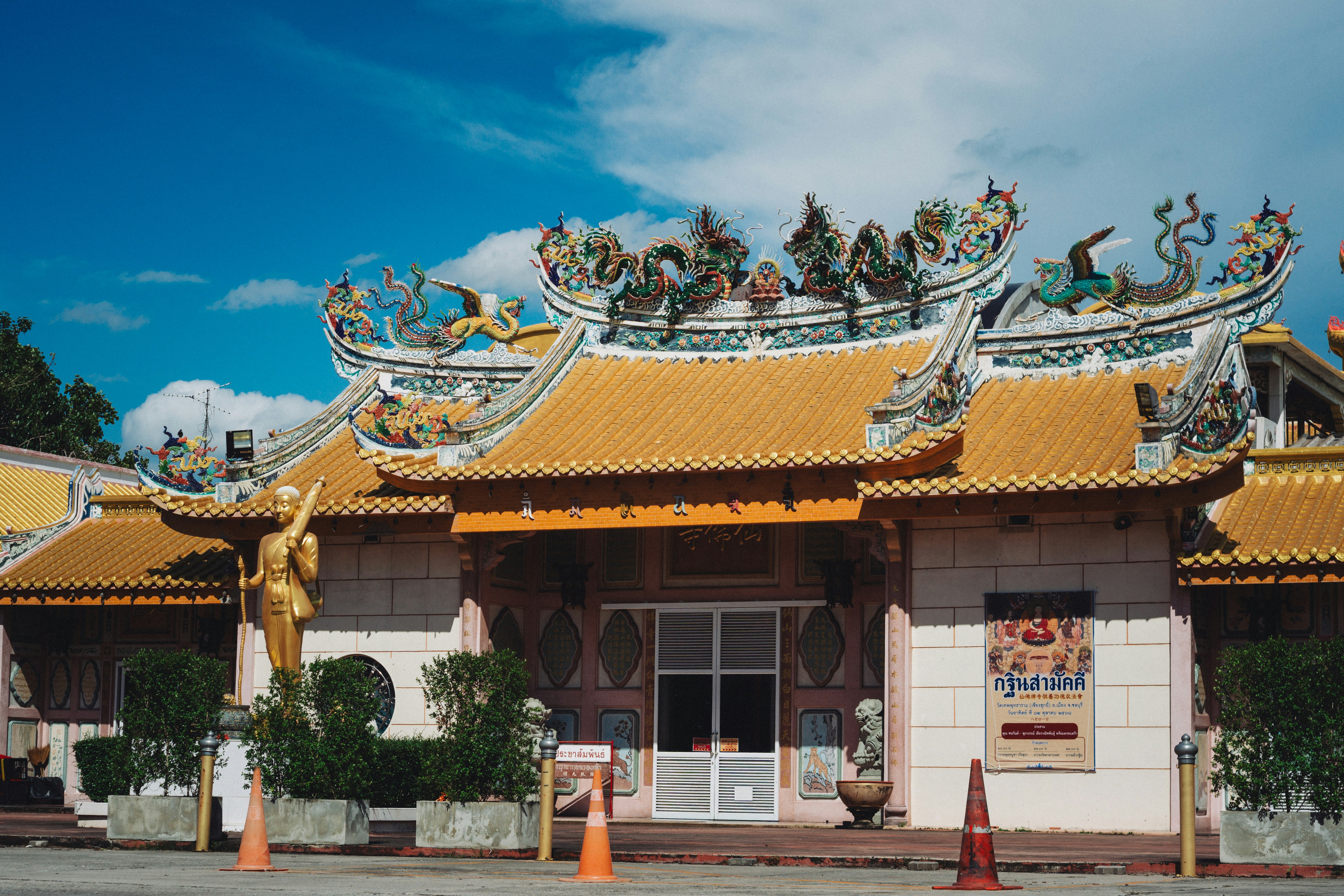 Dragon-Crested Roofs Crown a Sunlit Temple Facade