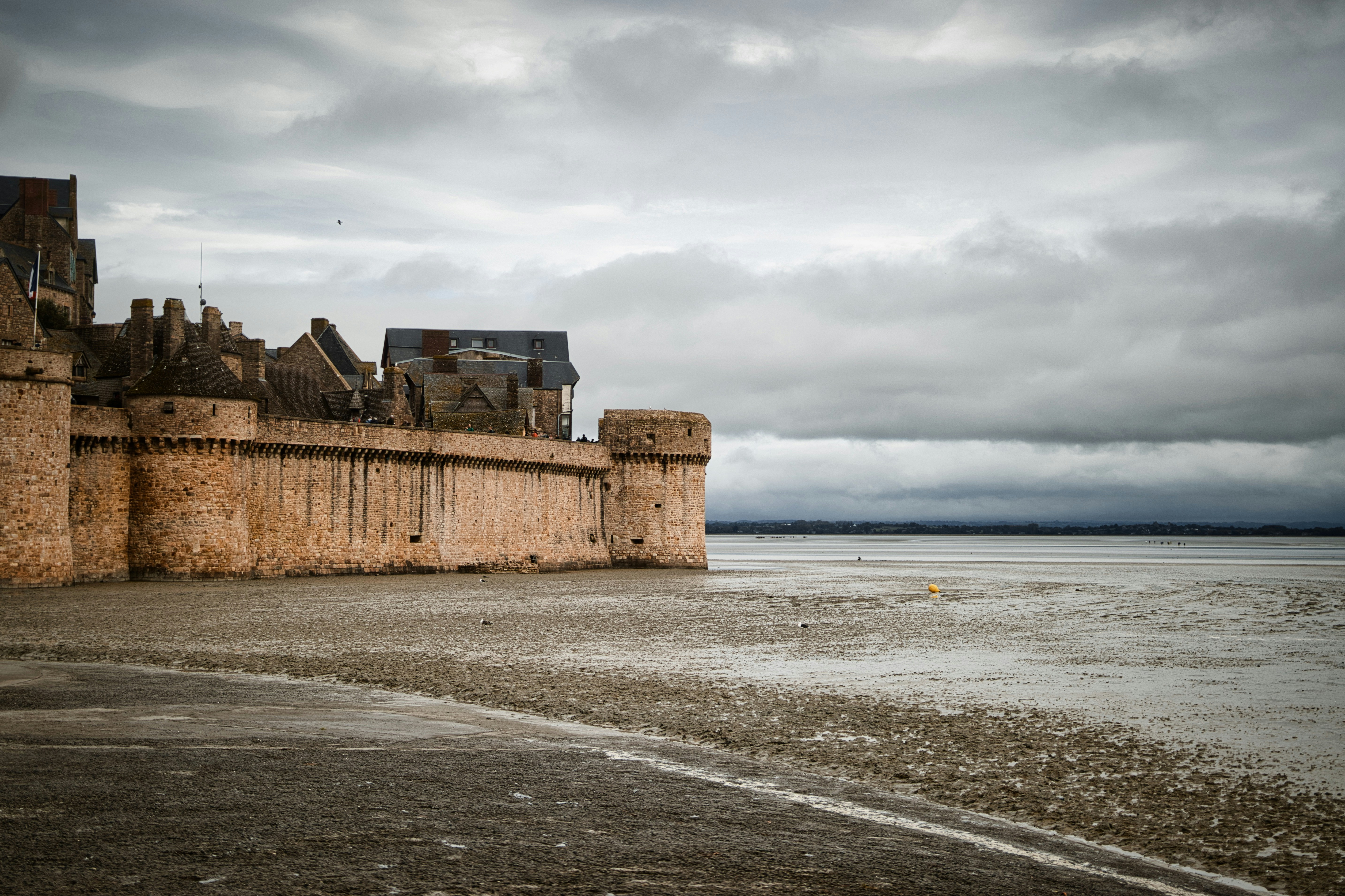 Stonebound Bastion: Weathered Walls at the Edge of a Tidal Plain