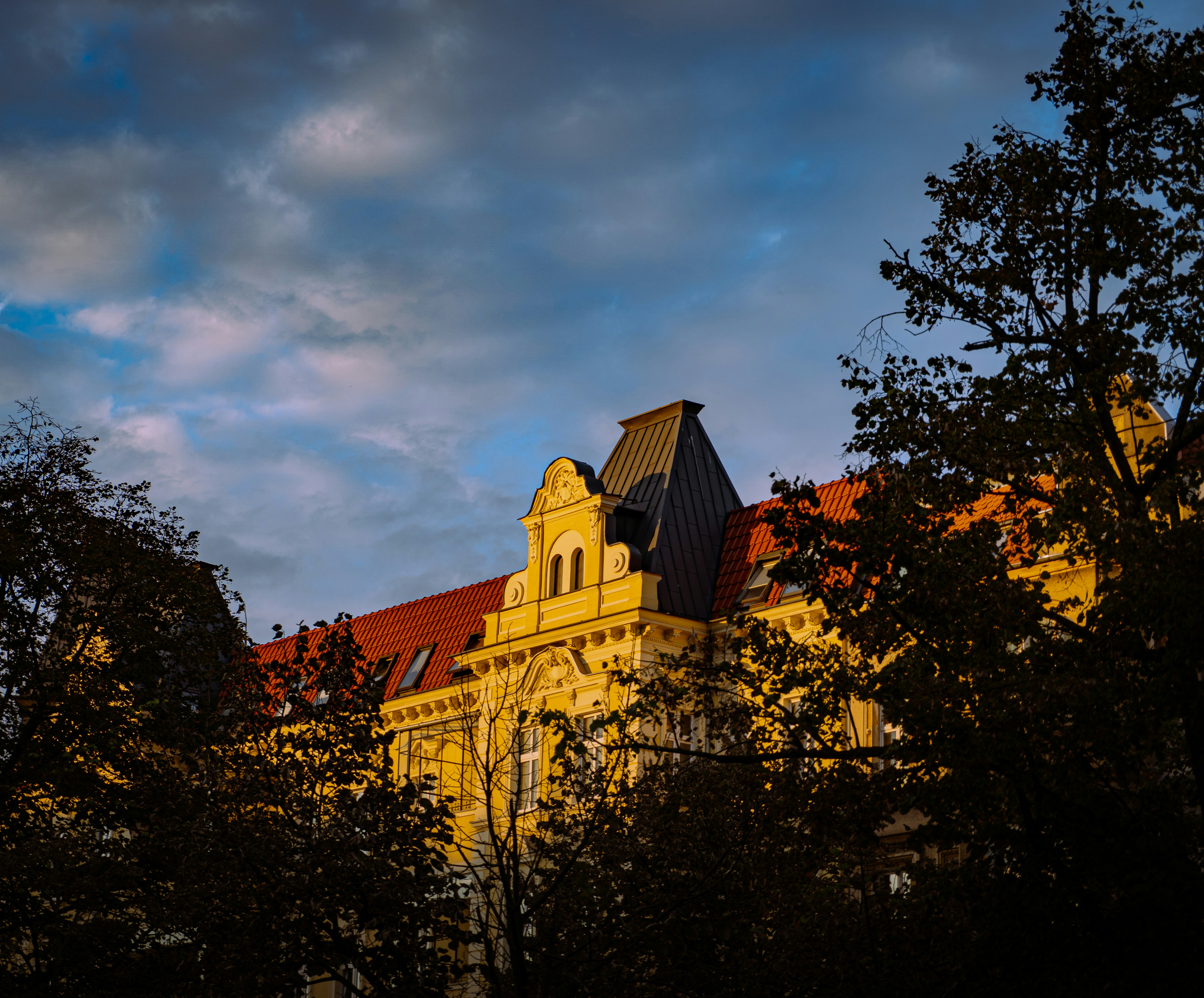 Ornate building facade bathed in golden hour light.