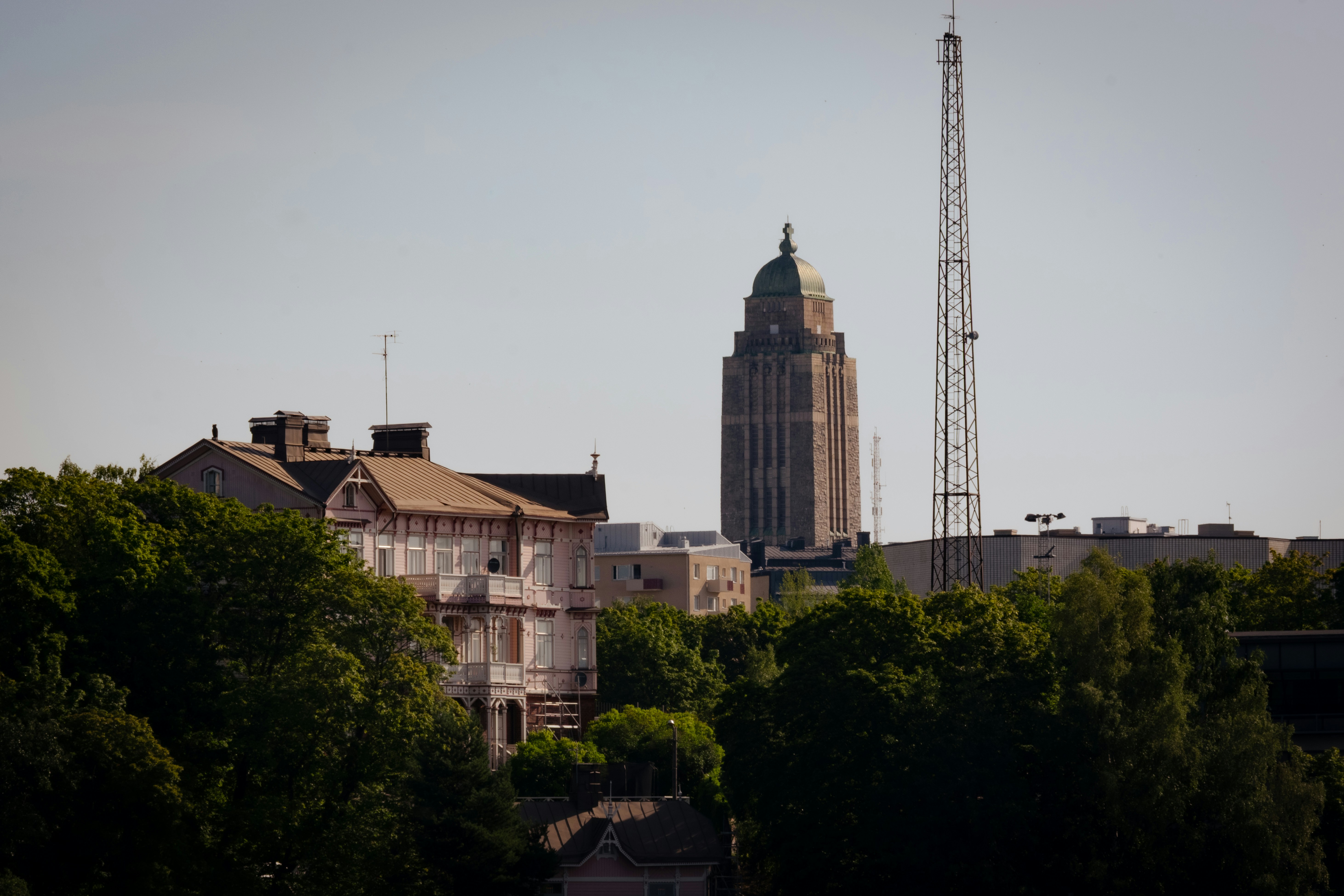 Urban Silhouette: A Towering Beacon Amidst Greenery