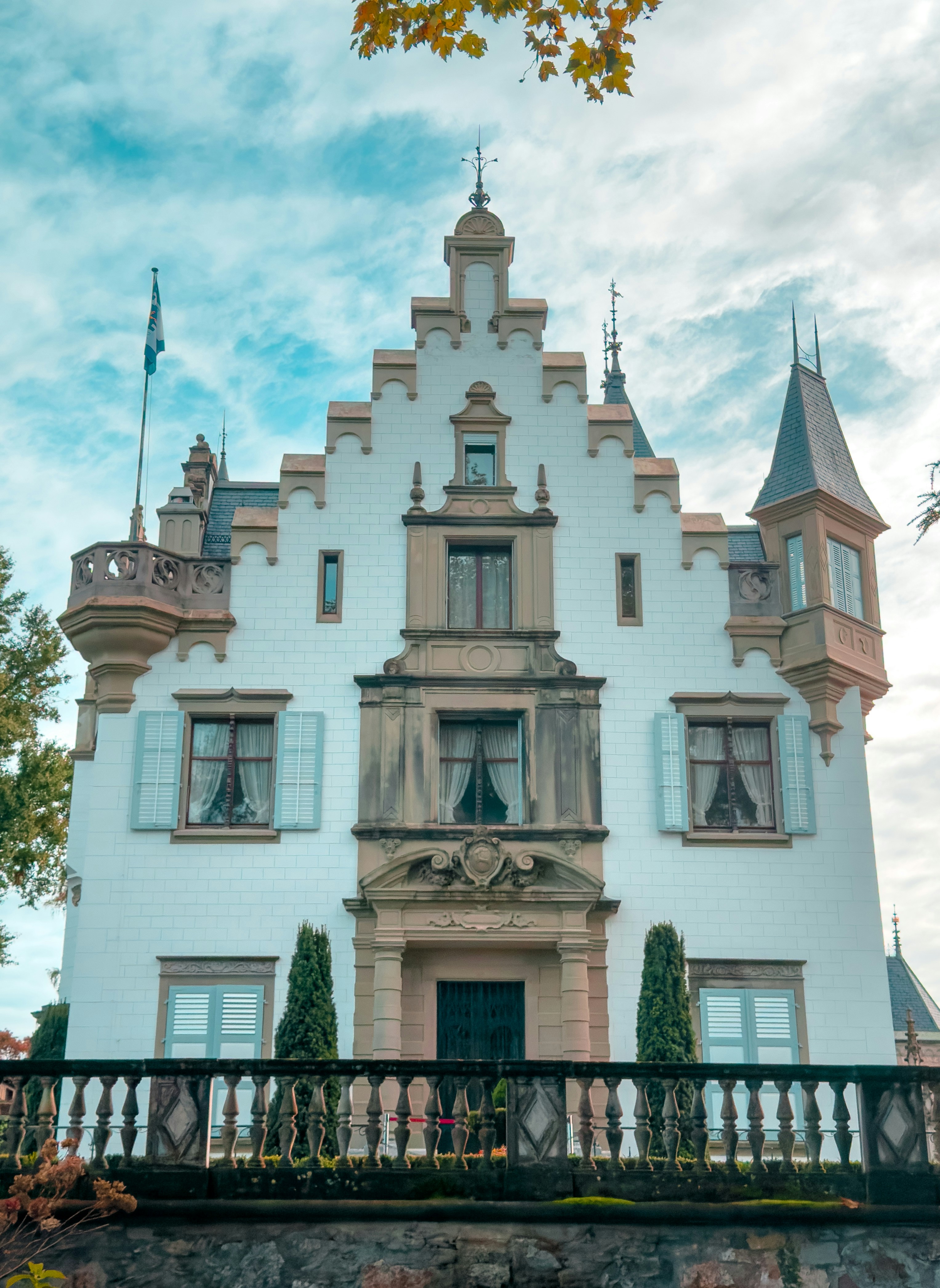 a beautiful church in Switzerland | White historic building with ornate facade and towers.