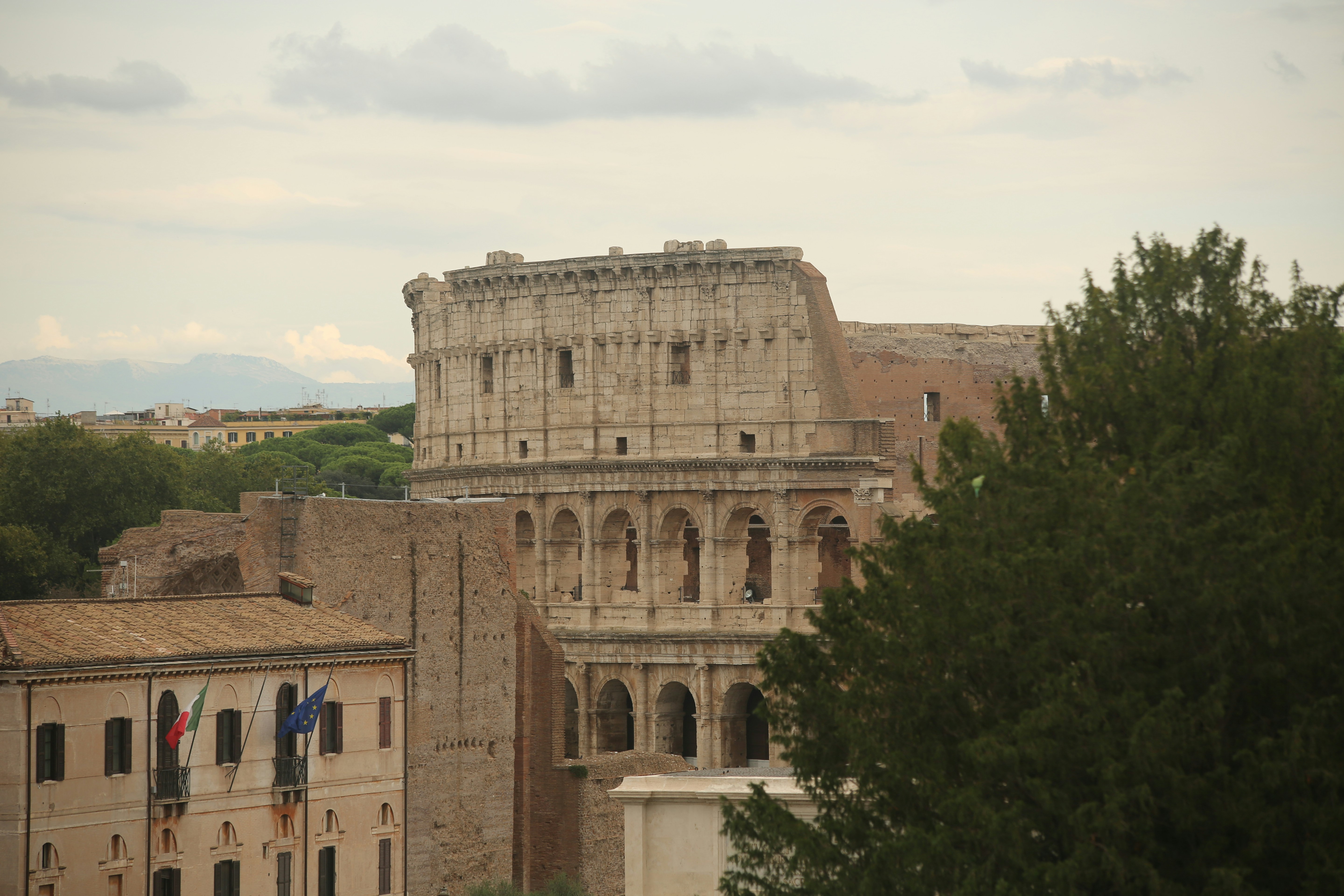 An image of the colosseum in Rome, Italy. Taken 2025. | The colosseum in rome under a cloudy sky.