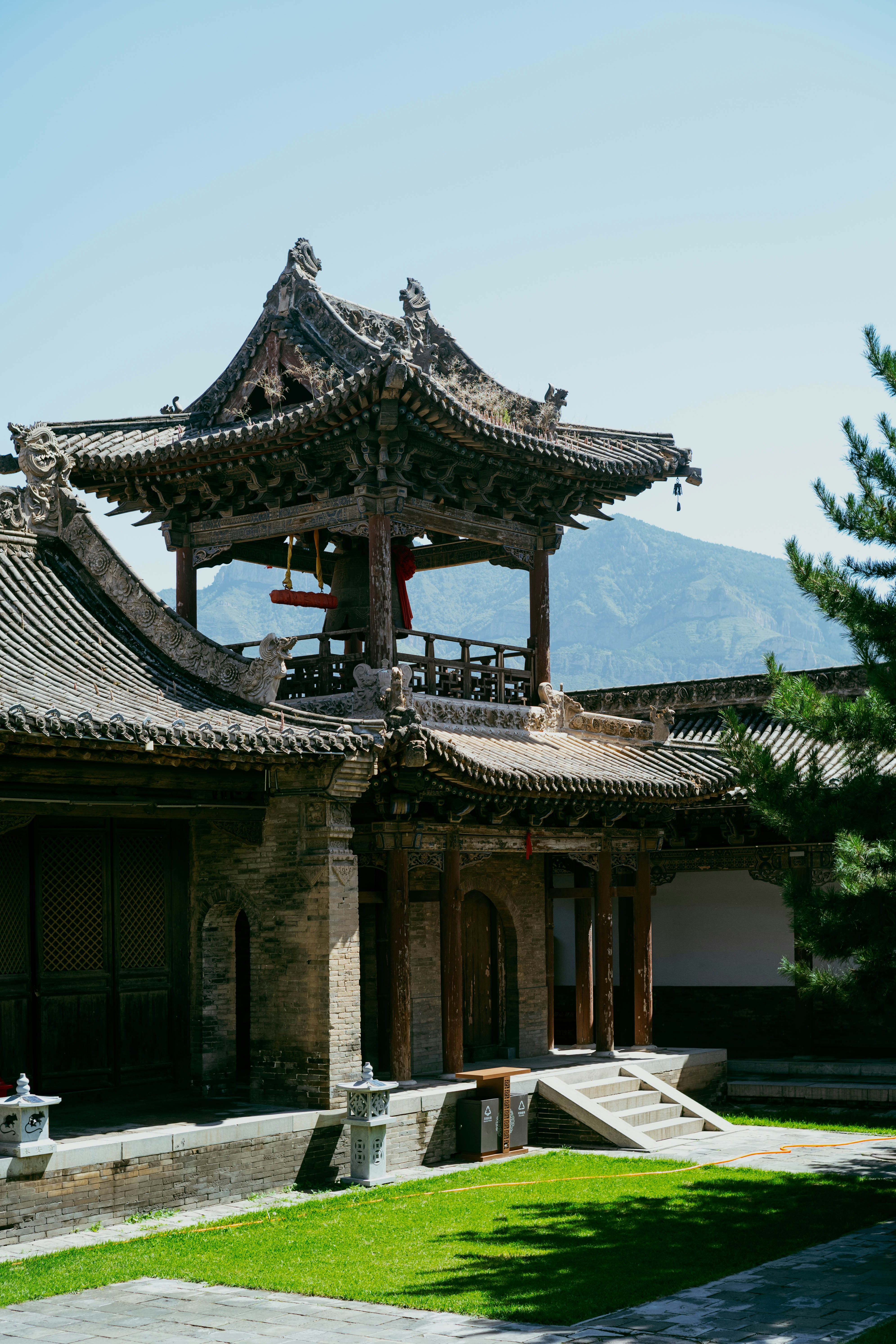 Traditional chinese temple architecture with a bell tower.