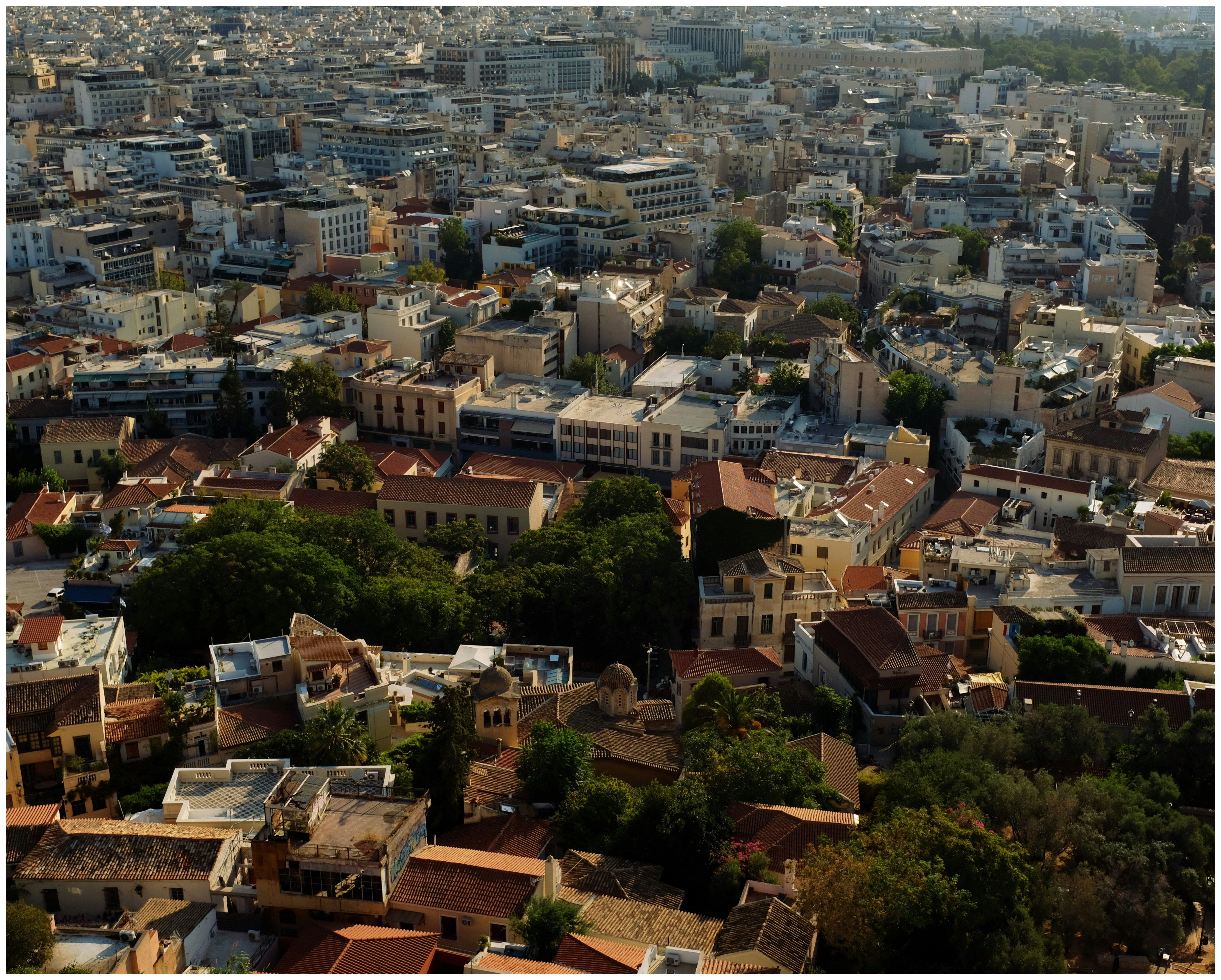 Aerial view of a dense urban cityscape with buildings.