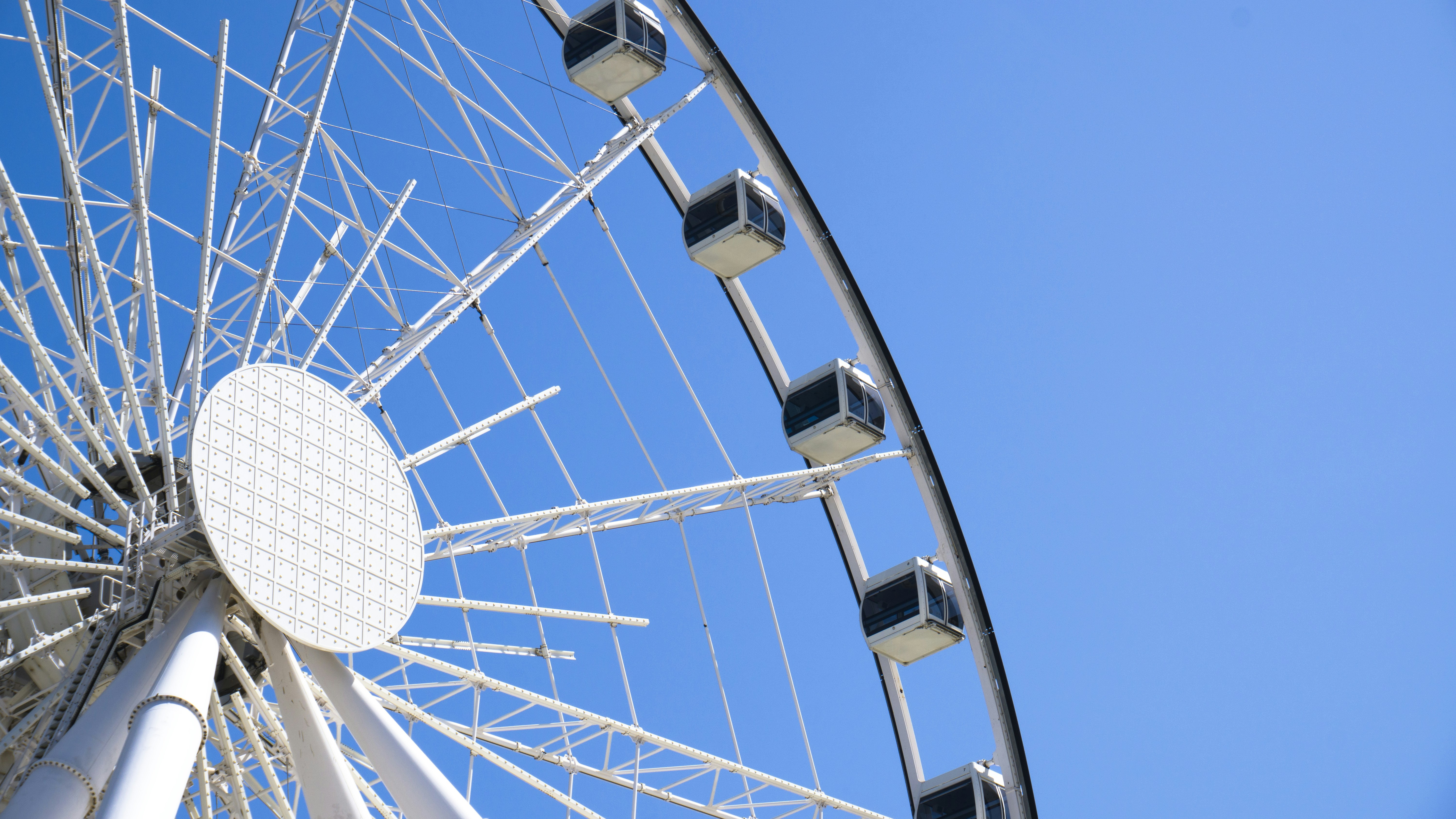 Baku Ferris Wheel | A white ferris wheel against a clear blue sky.