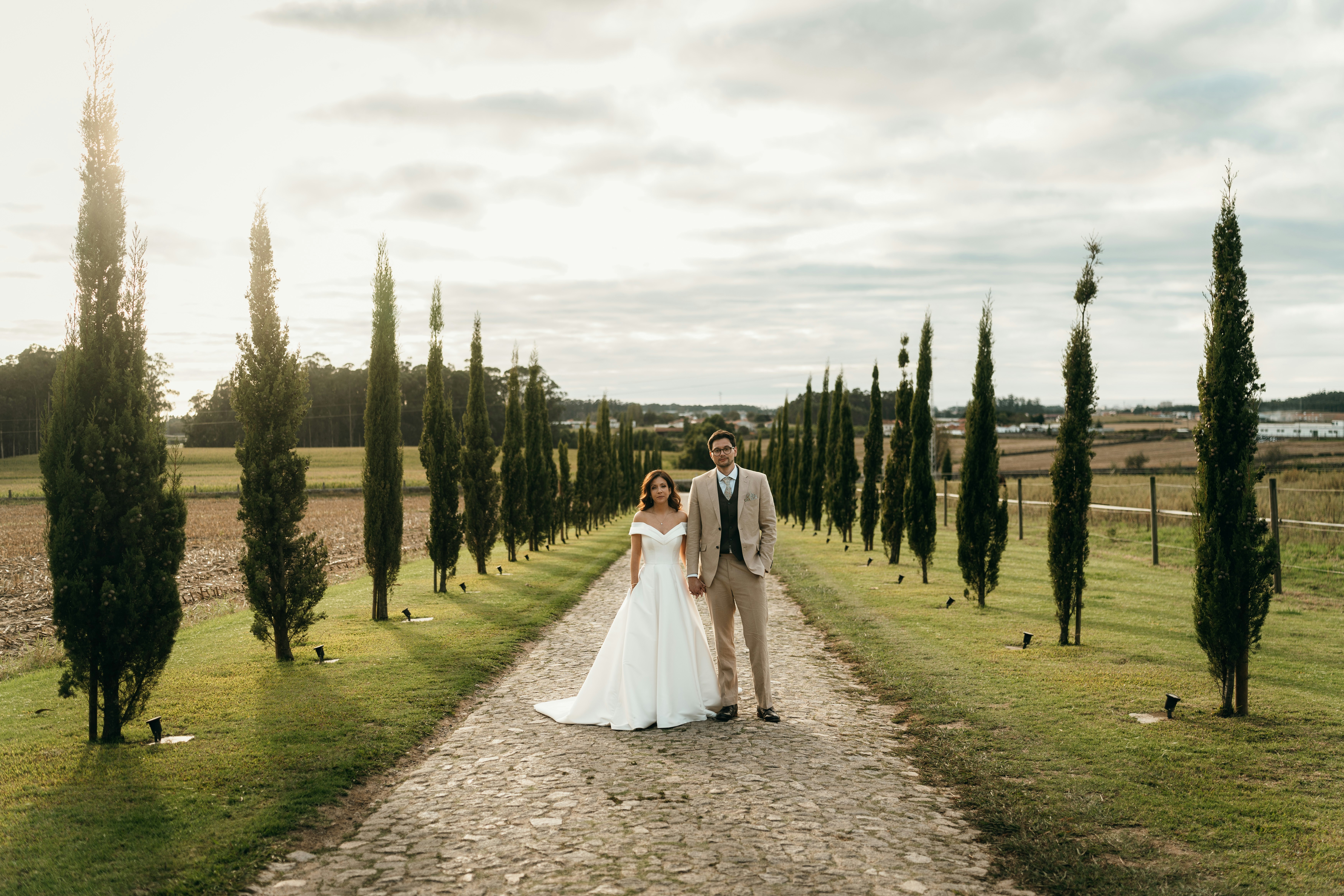 couple's portrait at their wedding in Quinta Alferes de Crasto, Porto, Portugal. photo by Pedro Pulido Photography | Bride and groom holding hands on a gravel path