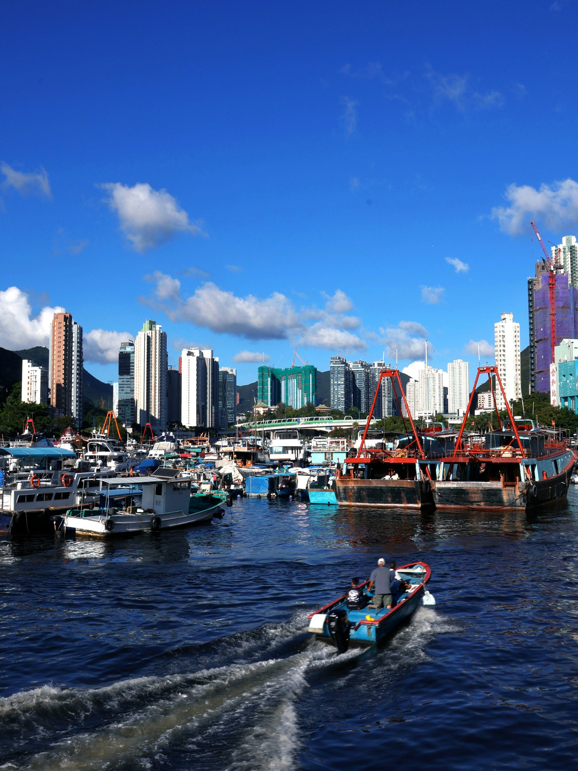 Harbor Harmony: A Dance of Boats and Skyscrapers