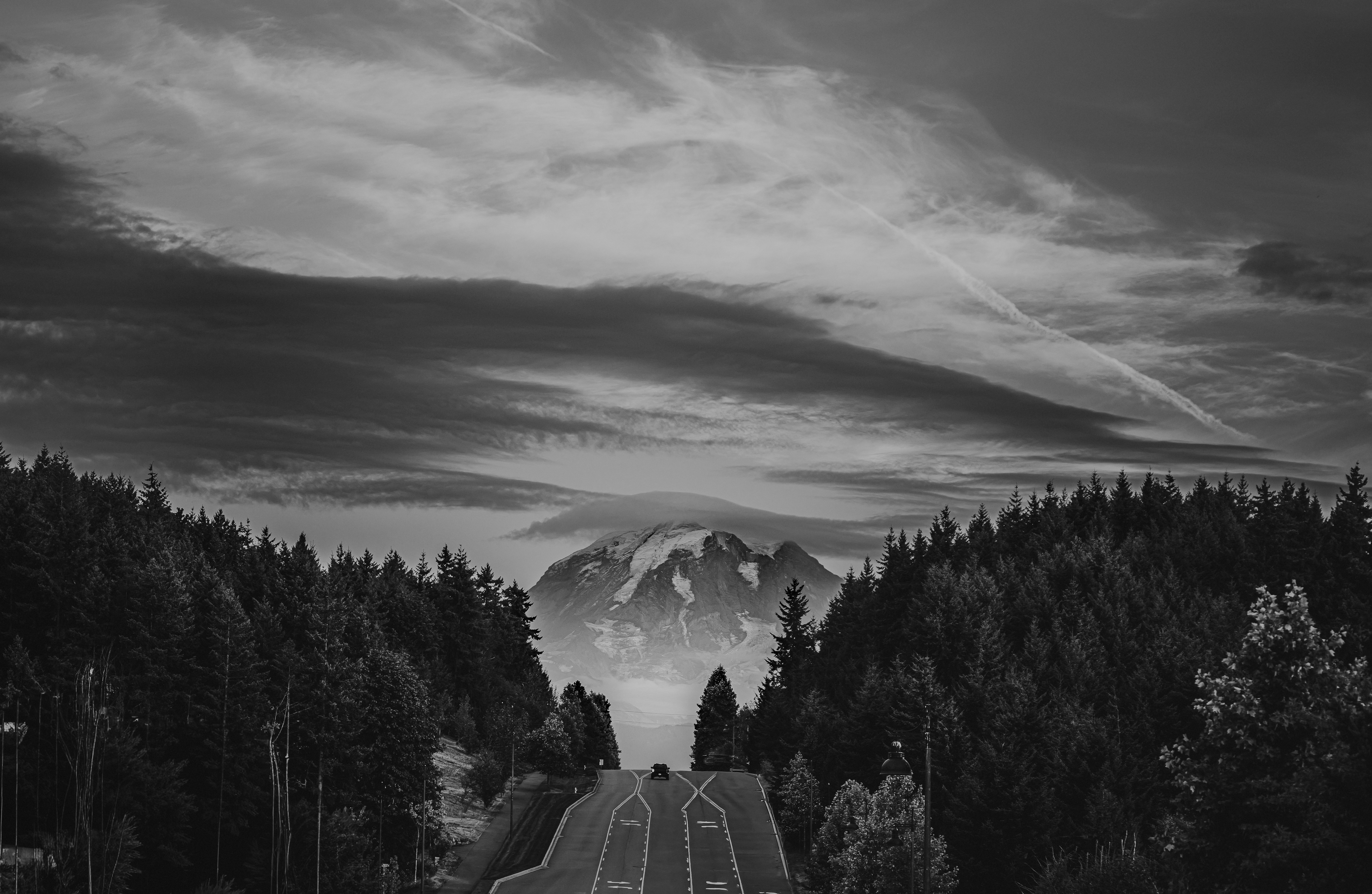 Dramatic mountain peak shrouded in mist and clouds.