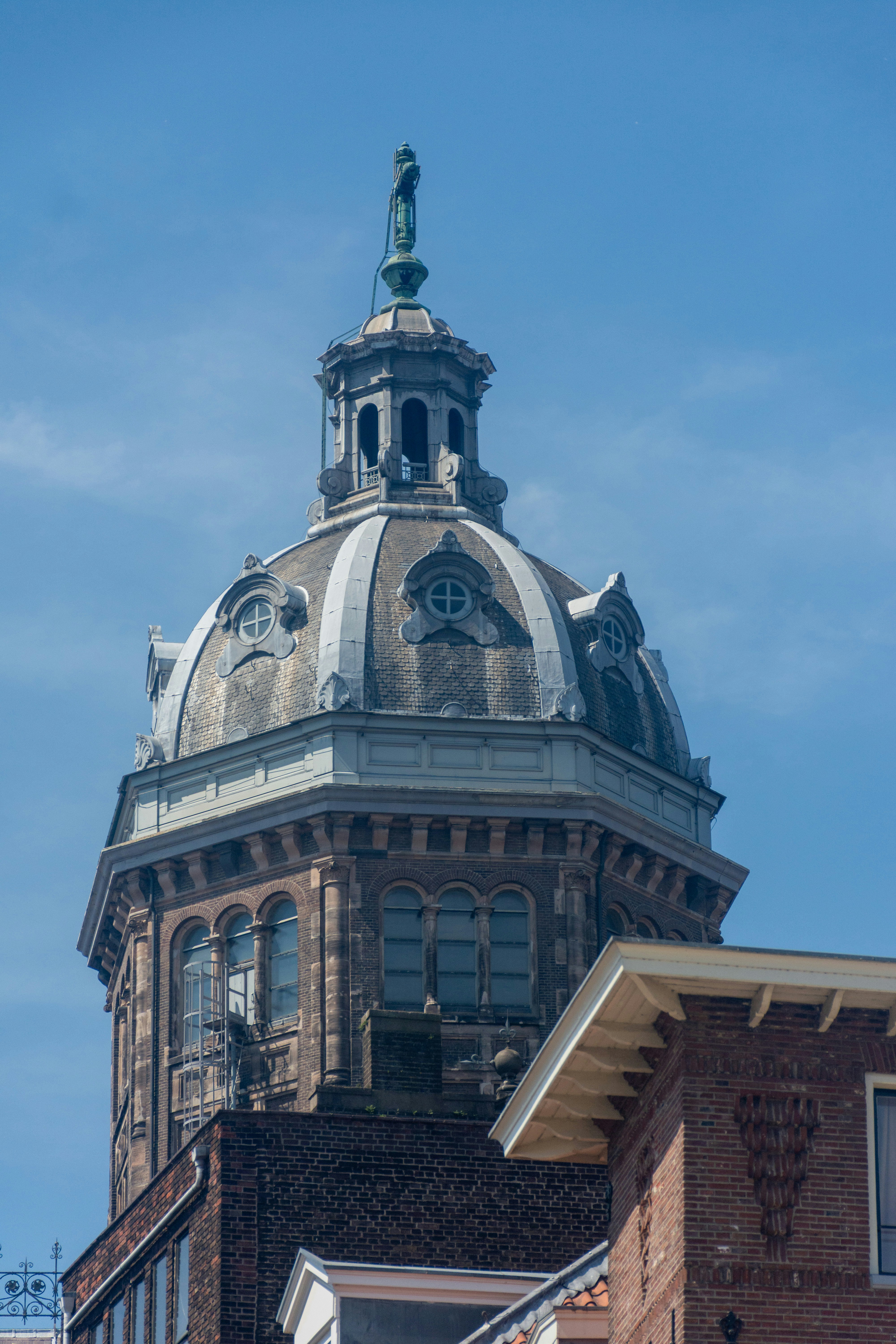Ornate dome of a historic building against blue sky