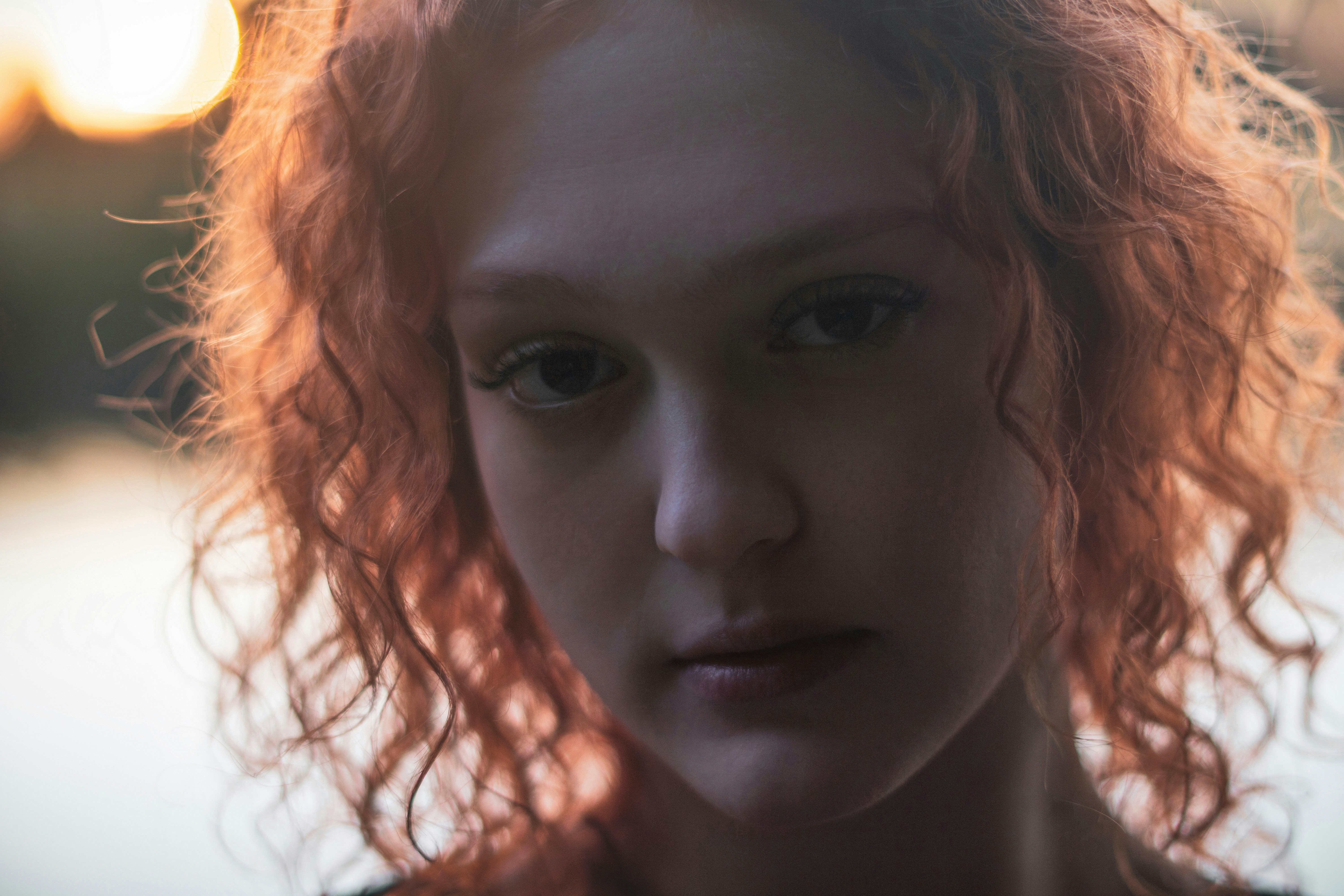 Young woman with curly red hair at sunset photo – Free Portrait Image ...