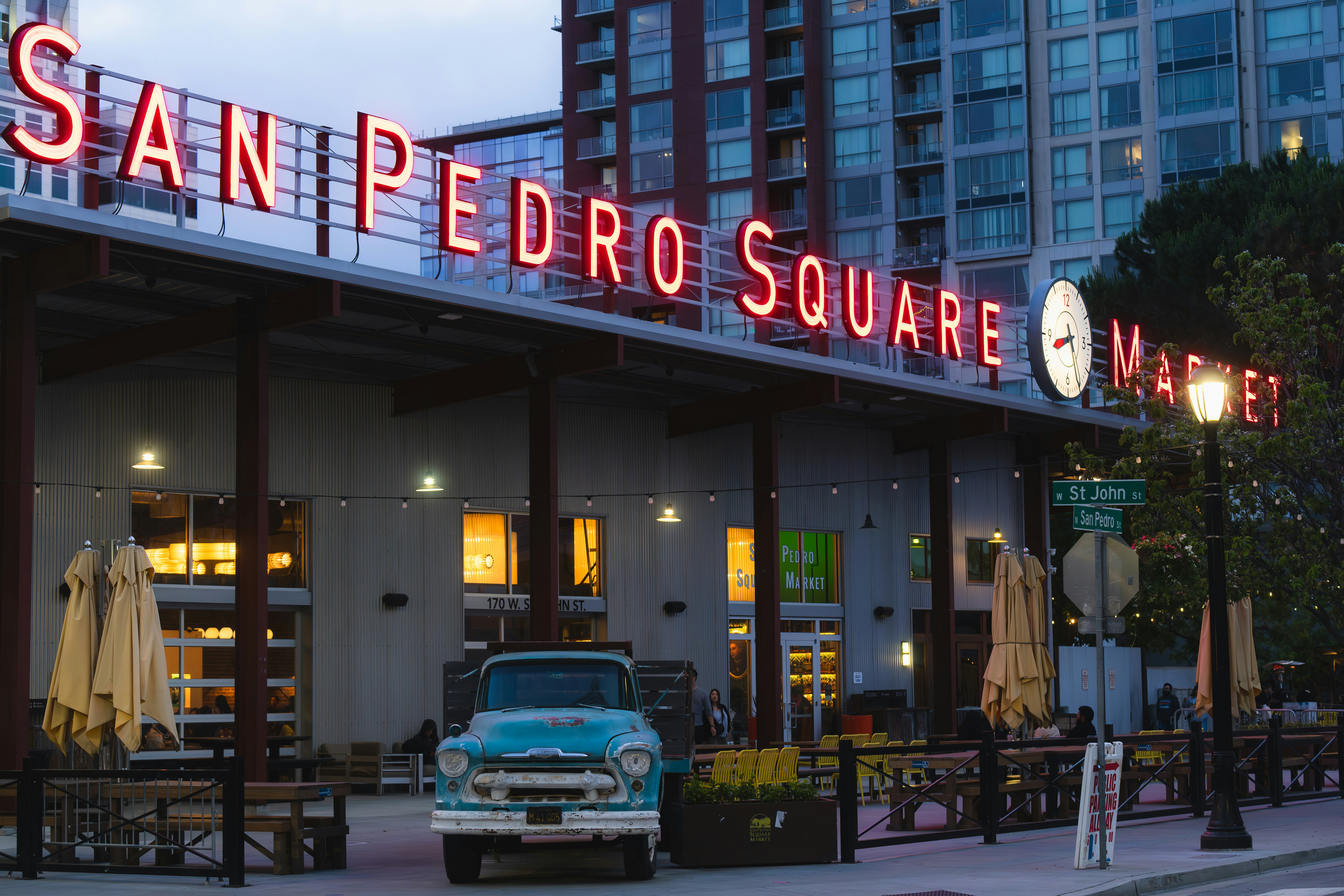 San Pedro Square, 2024 | San pedro square market building with neon sign at dusk.