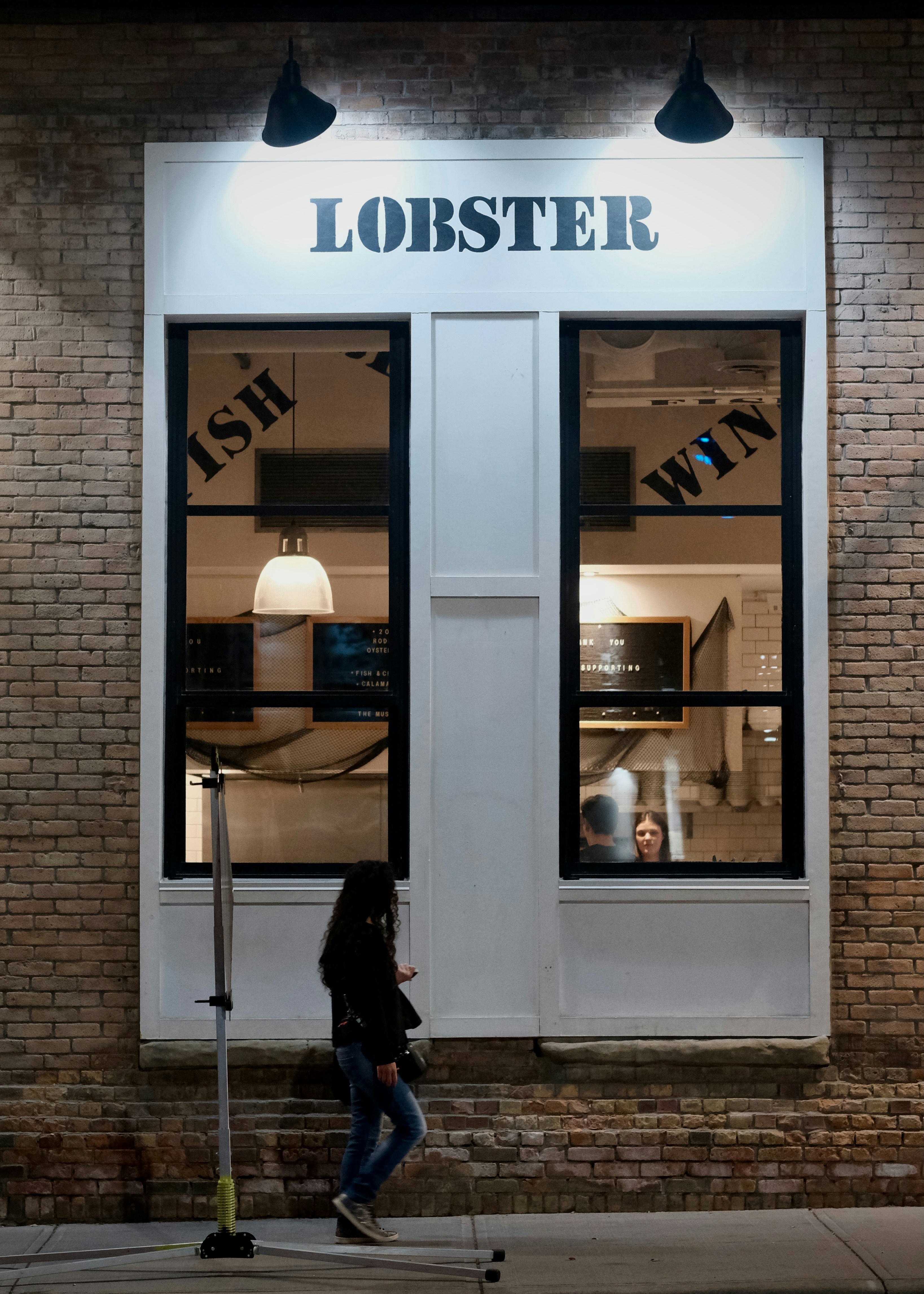 Restaurant exterior with lobster sign and window display