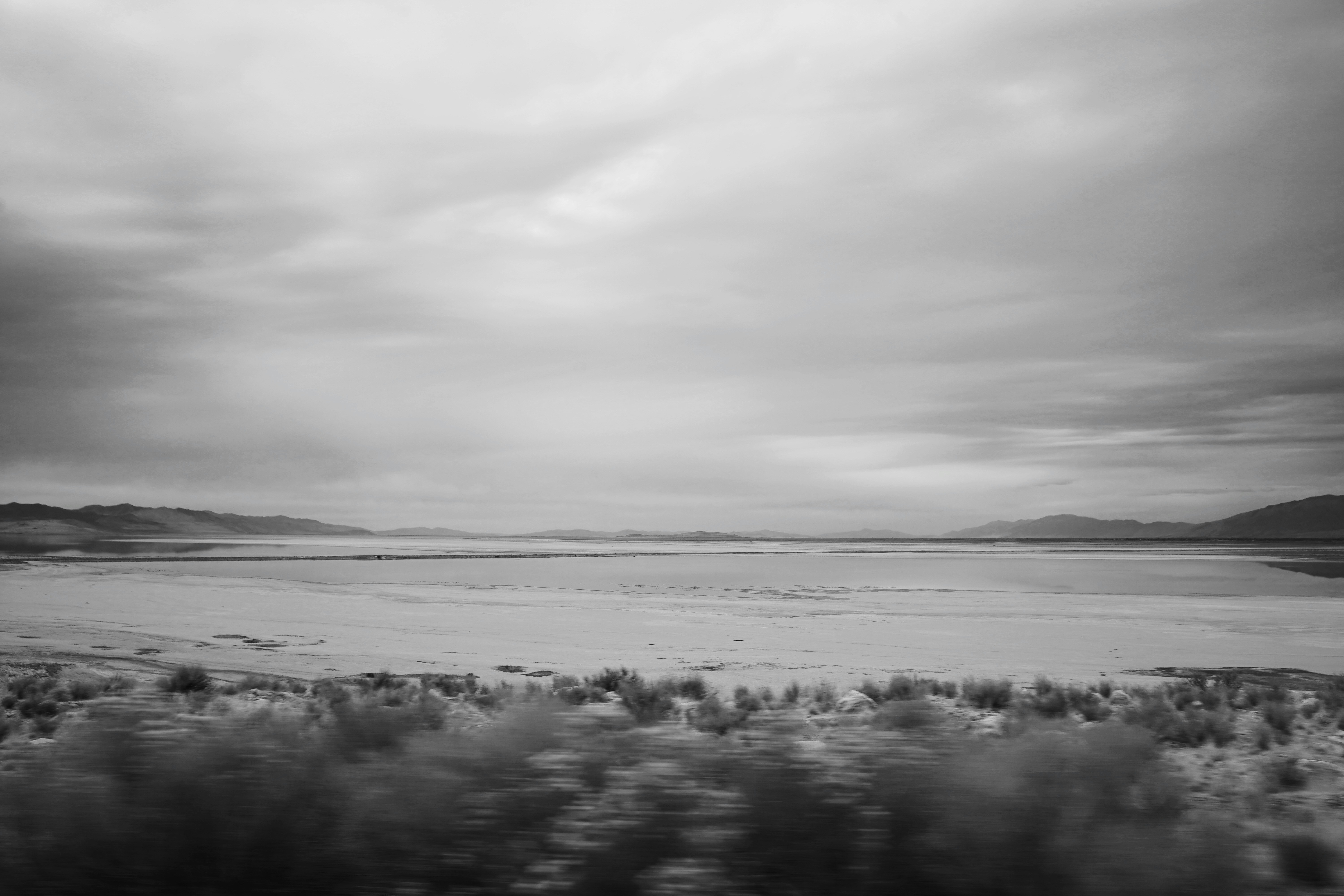 Vast, flat landscape under a cloudy sky.