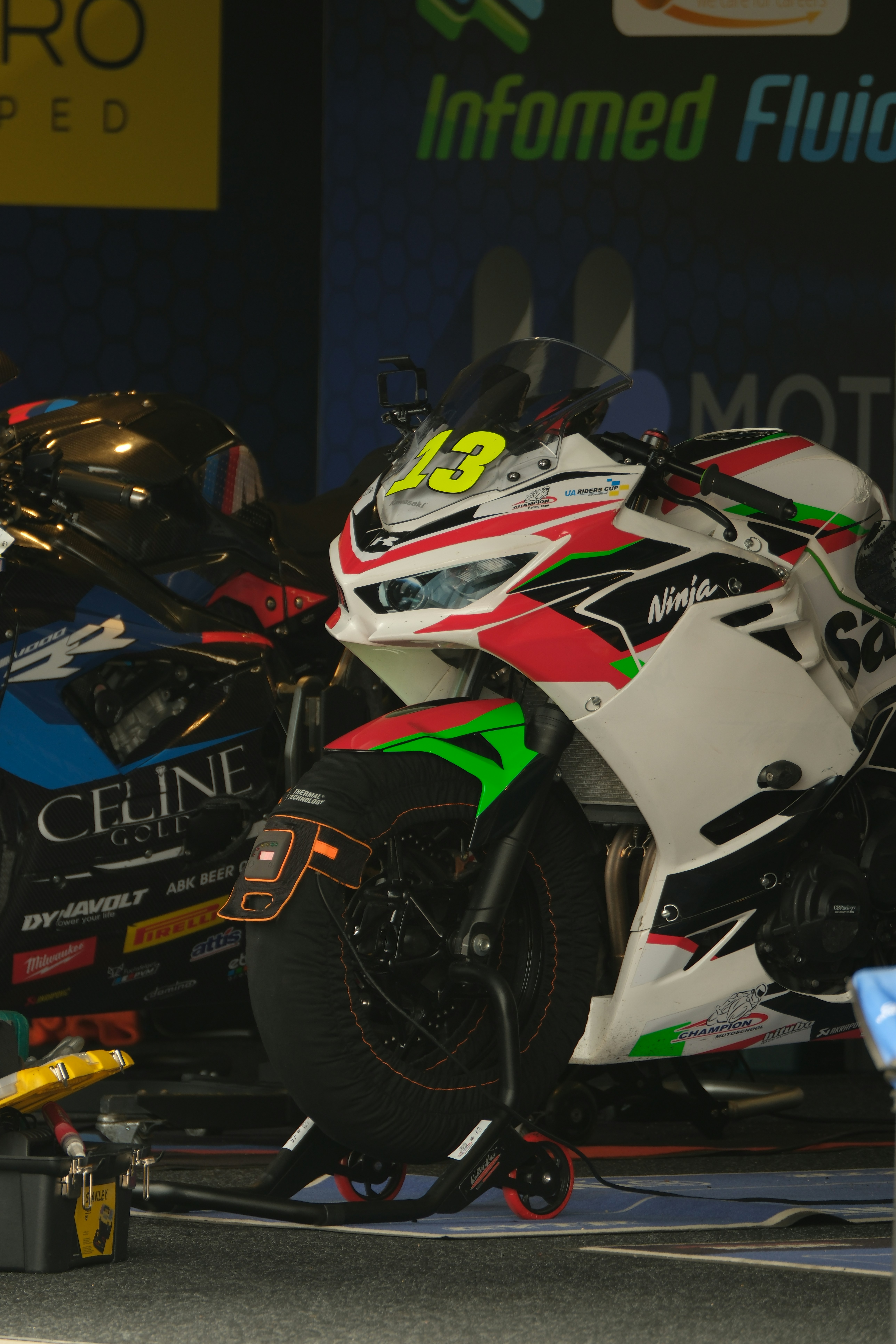 Race motorcycles with number 13 on display