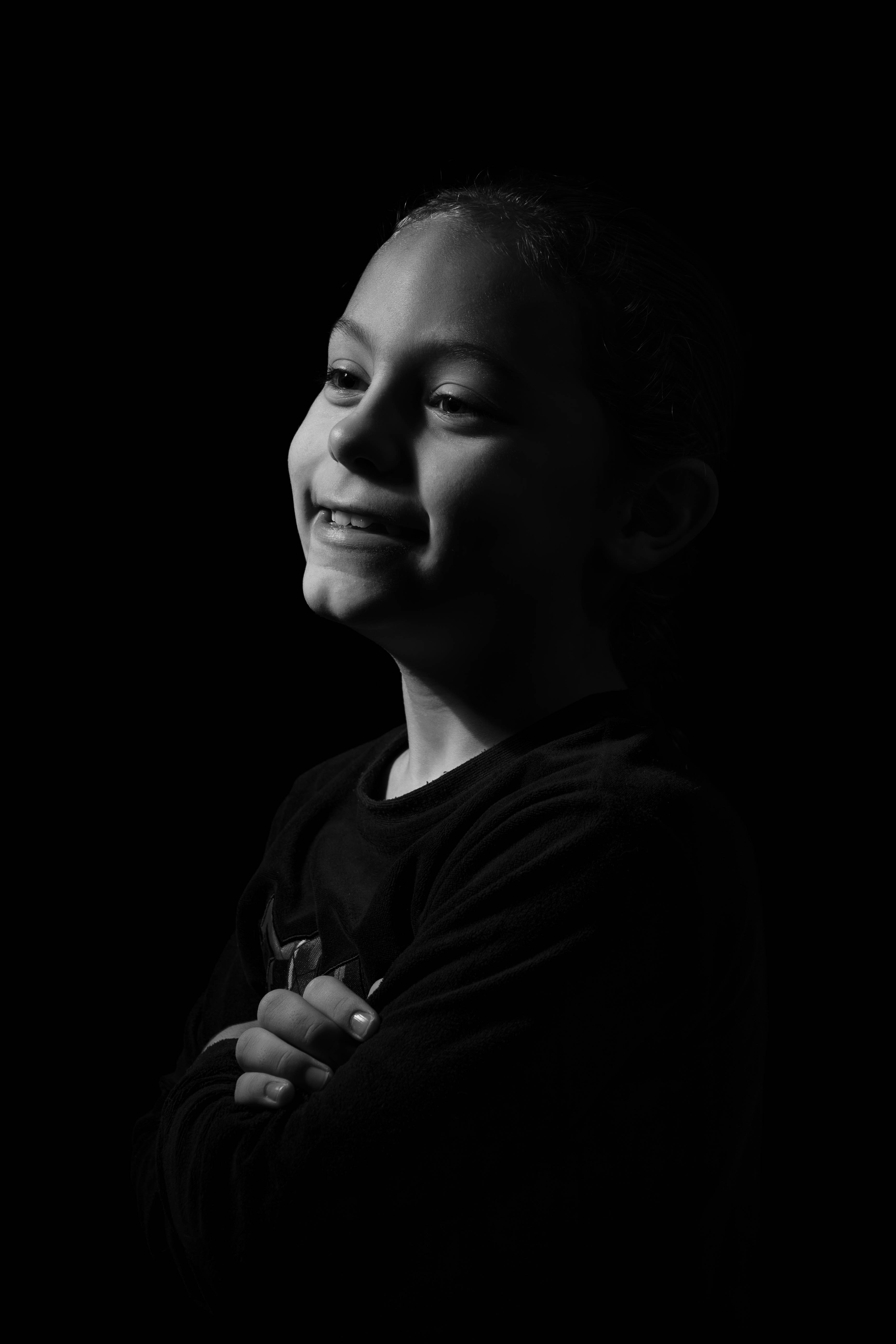 Silent Confidence: A Portrait in Shadows