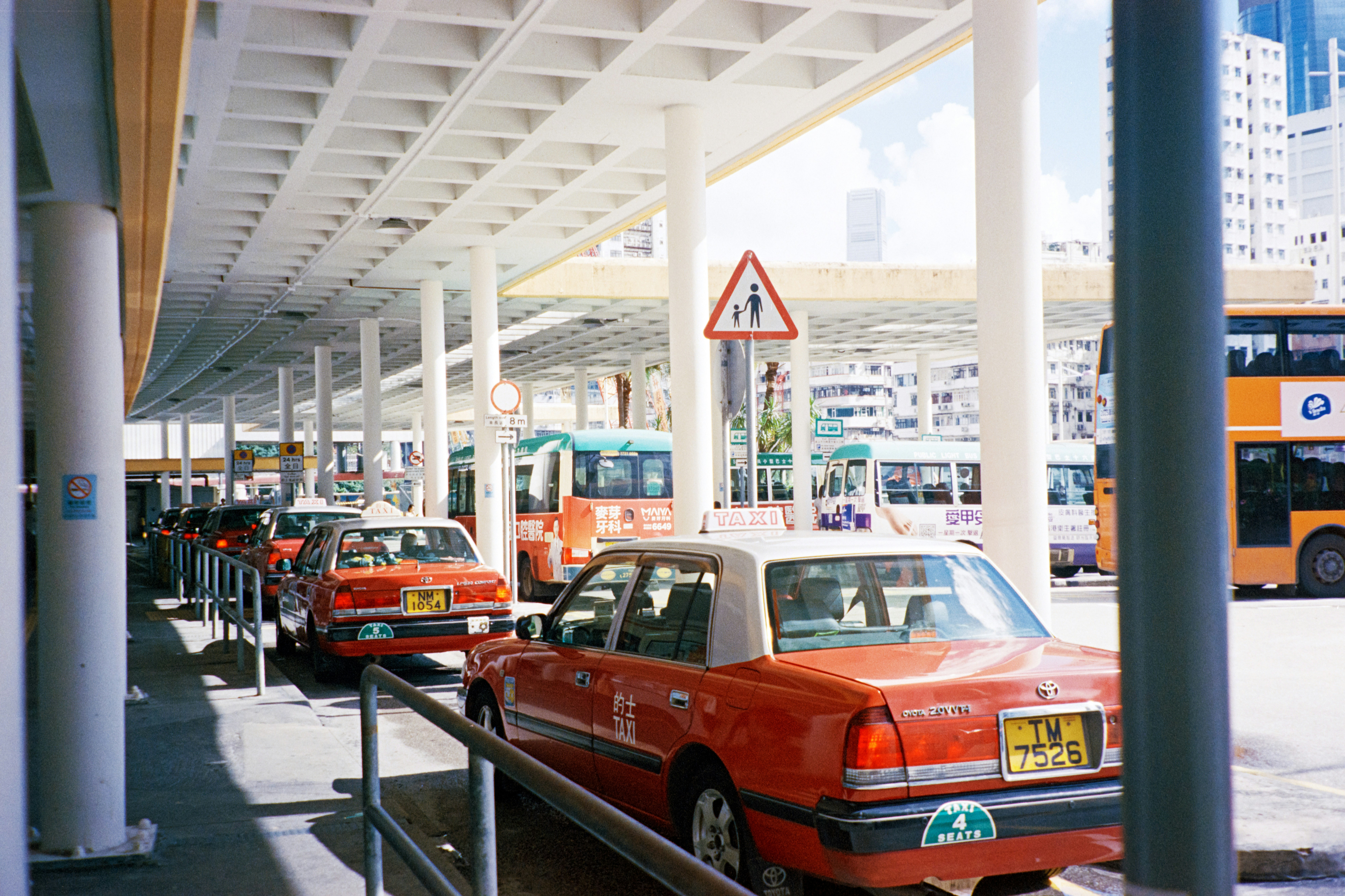 Urban Transit Harmony: A Taxi Stand in Motion