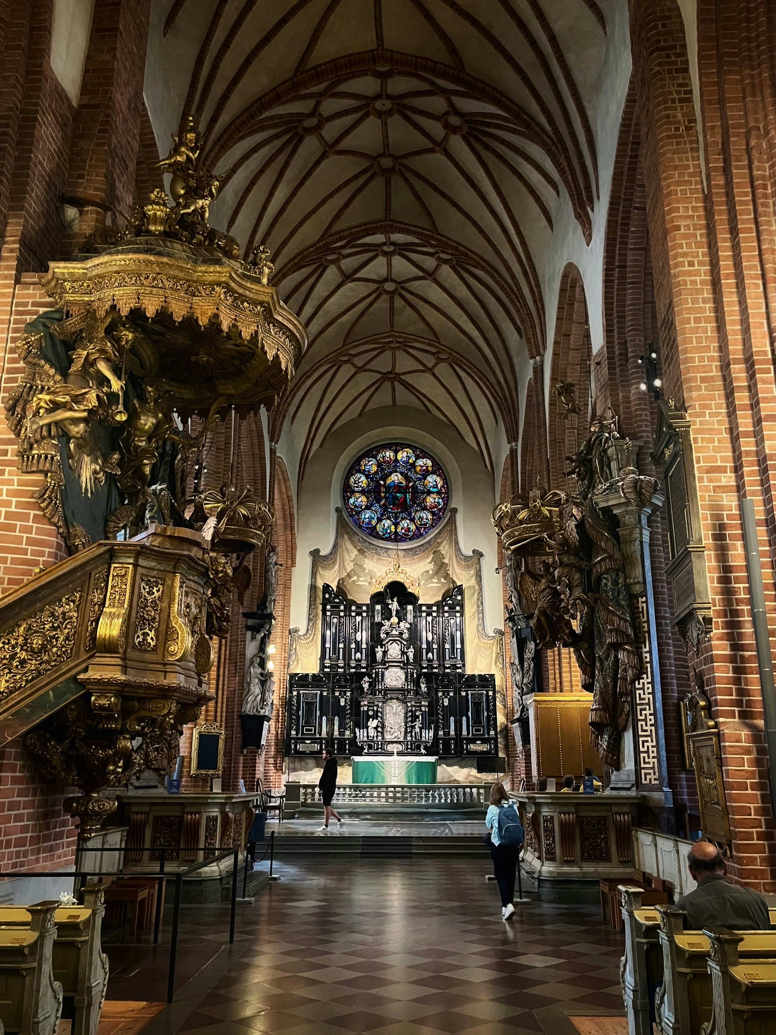 Stockholm #12 | Interior of a grand cathedral with ornate pulpit and altar.