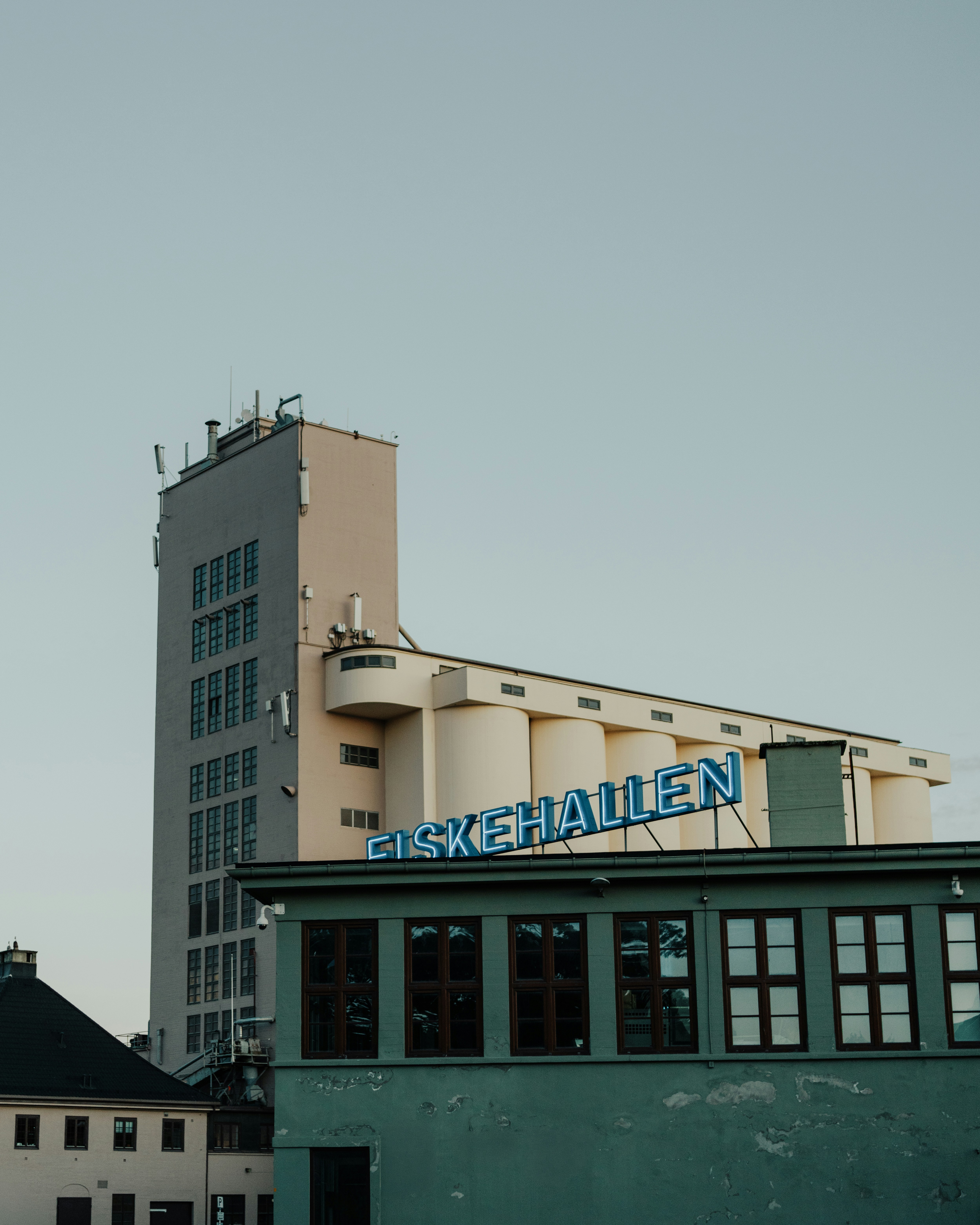 Modern industrial building with fiskehallen sign.