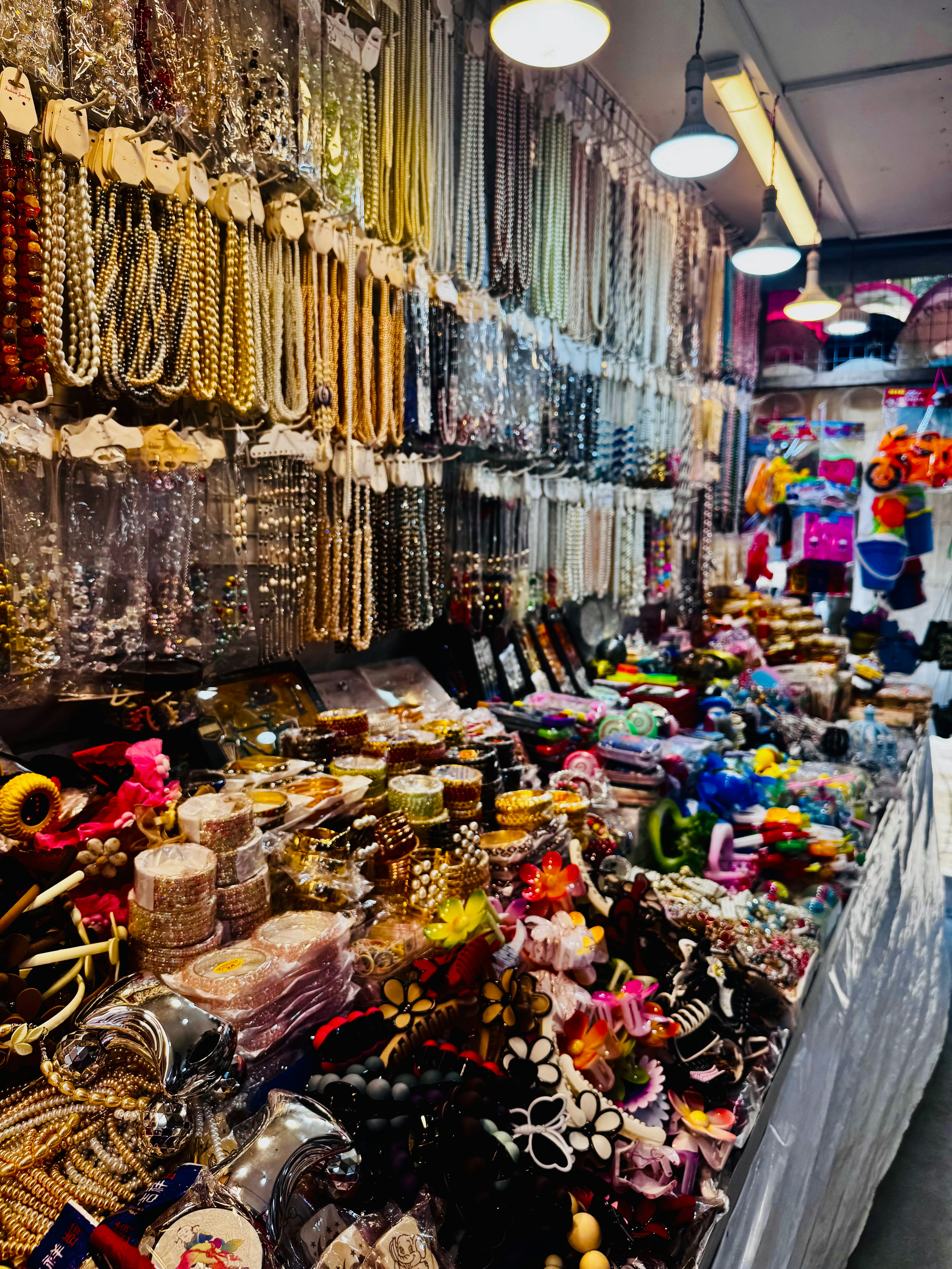 A stall filled with colorful jewelry and accessories