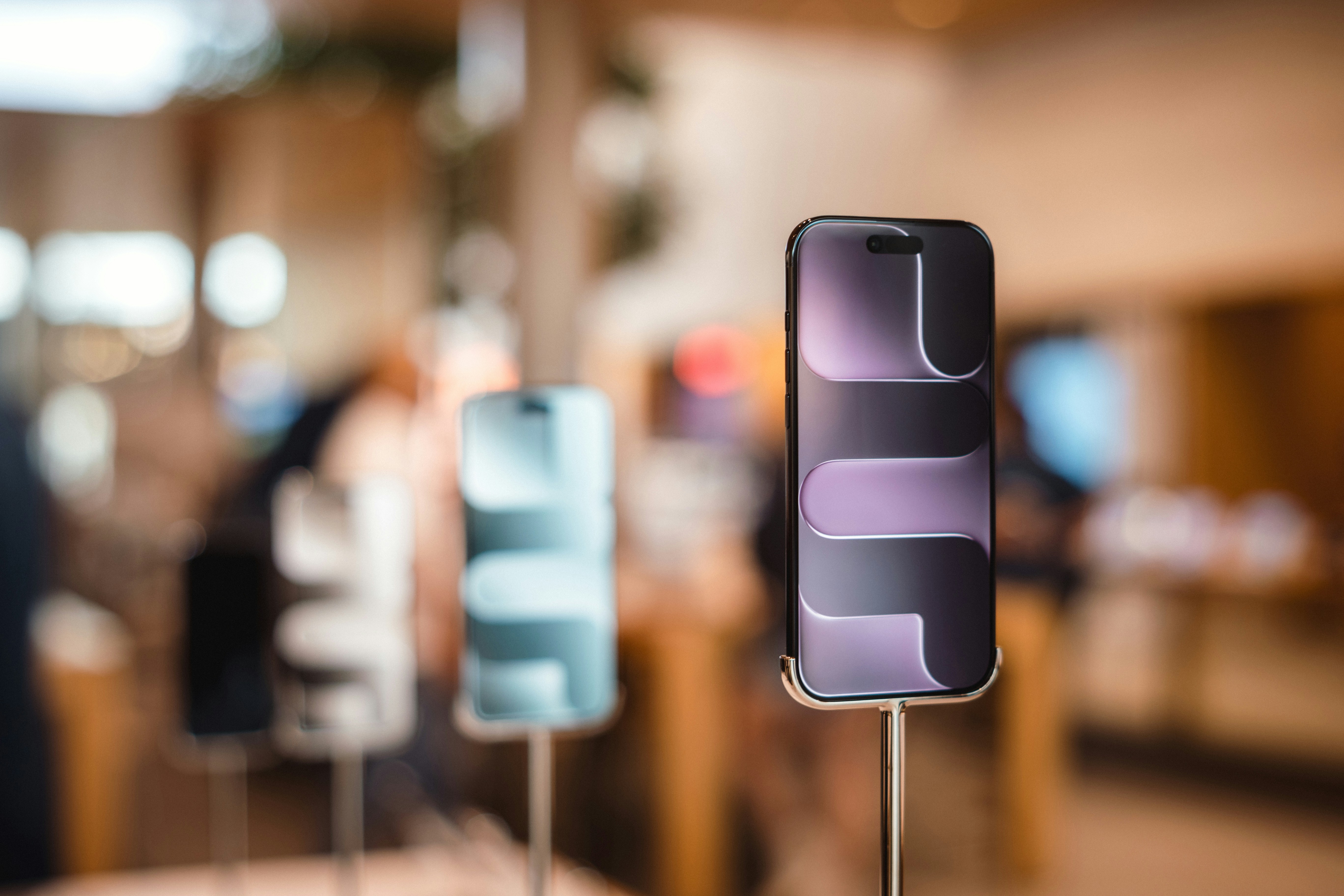 Smartphones displayed on stands in a store
