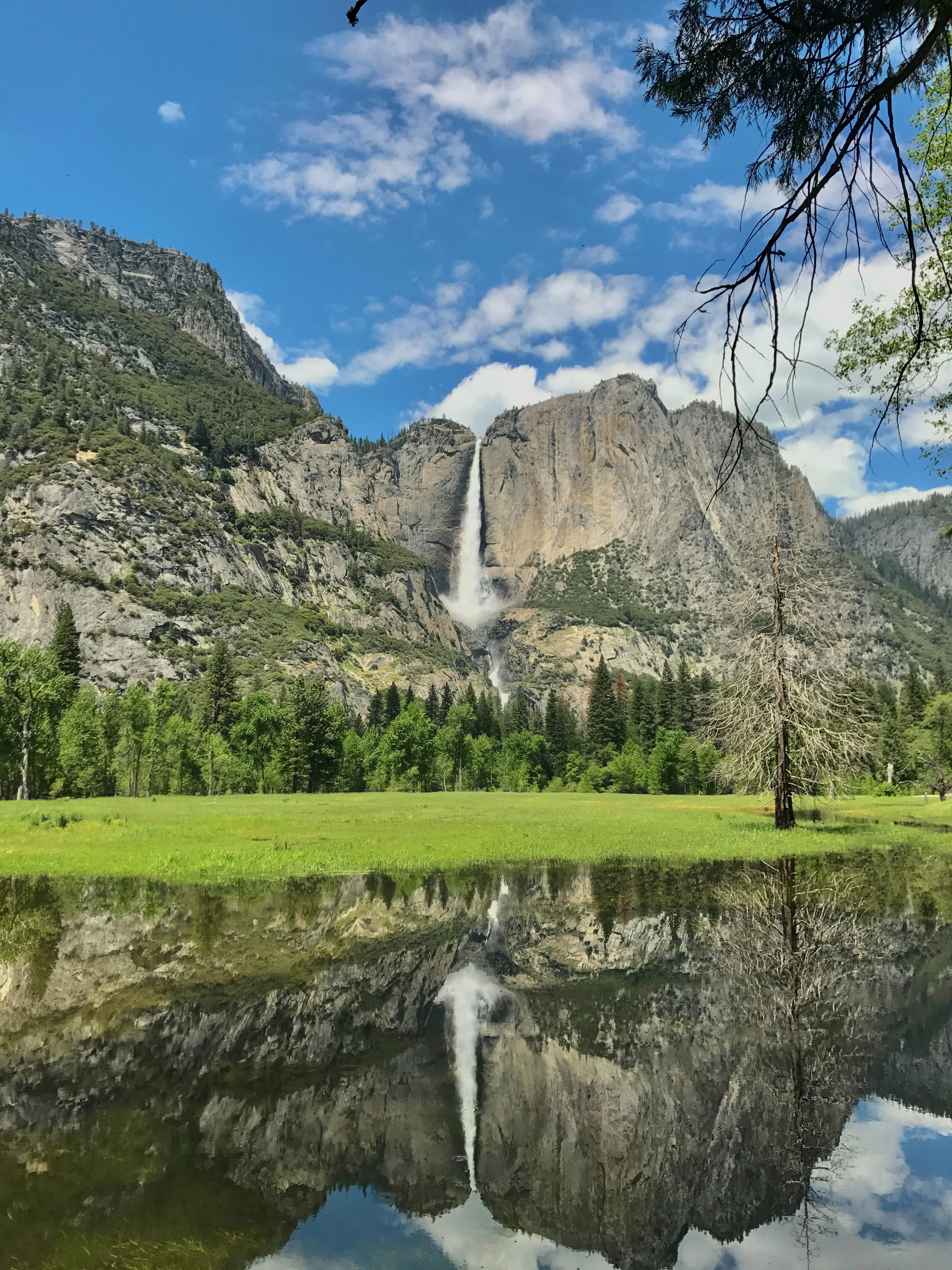 #nature #yosemite #wallpaper | Waterfall cascading down a mountain reflected in a lake.