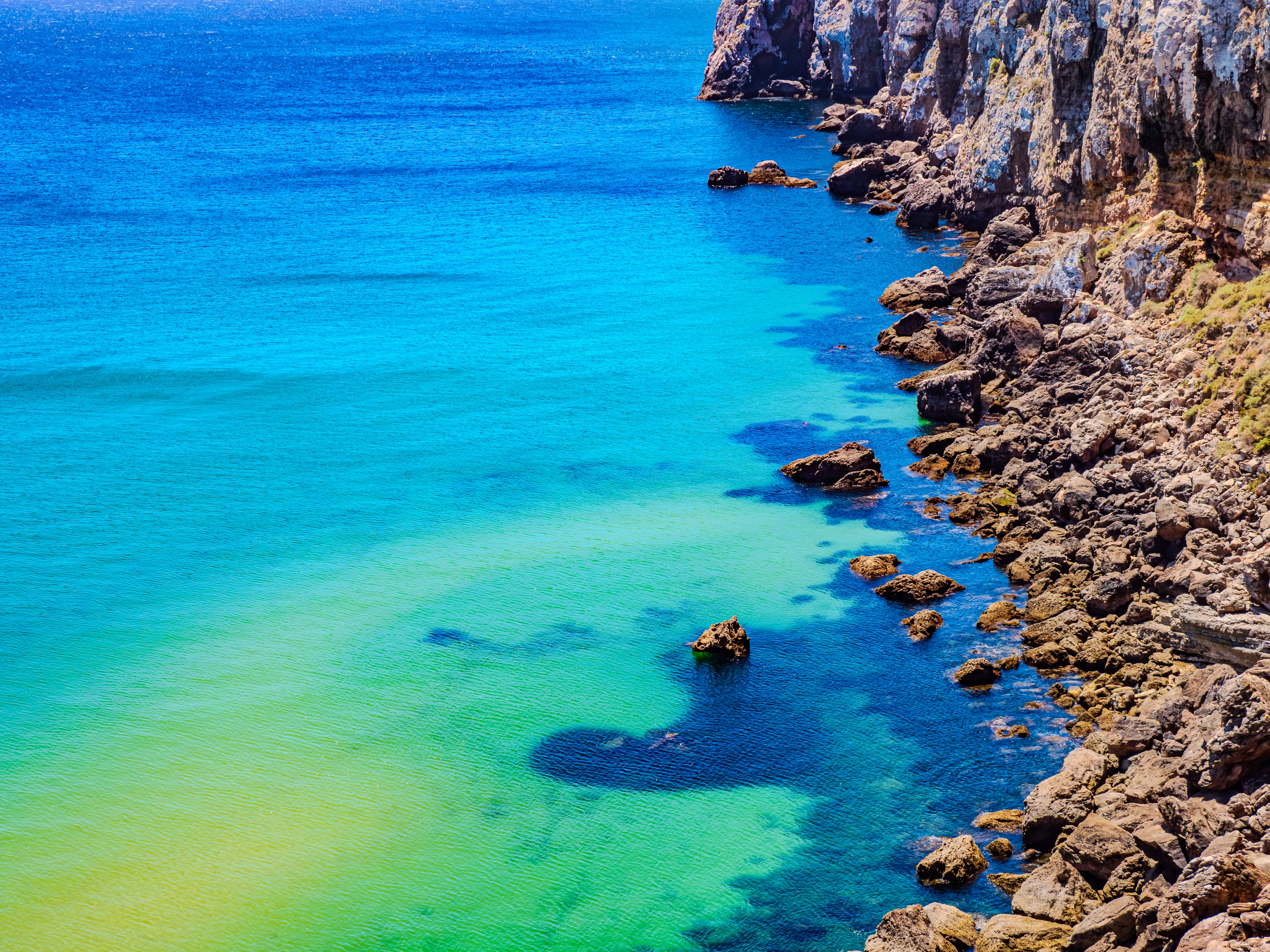 Emerald Tides and Rugged Cliffs