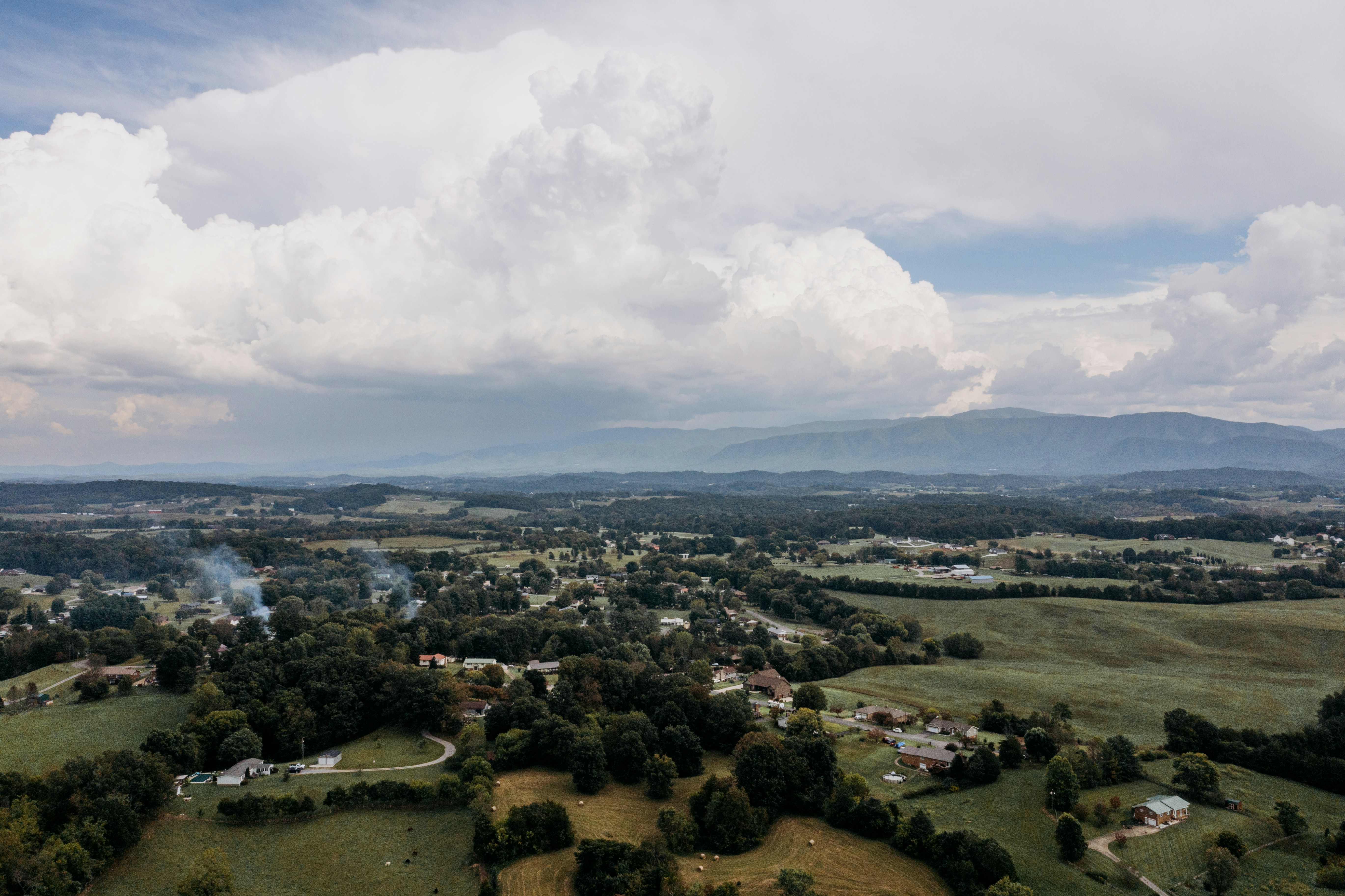 Smoke Trails Across Patchwork Fields: A Drone’s-Eye Panorama