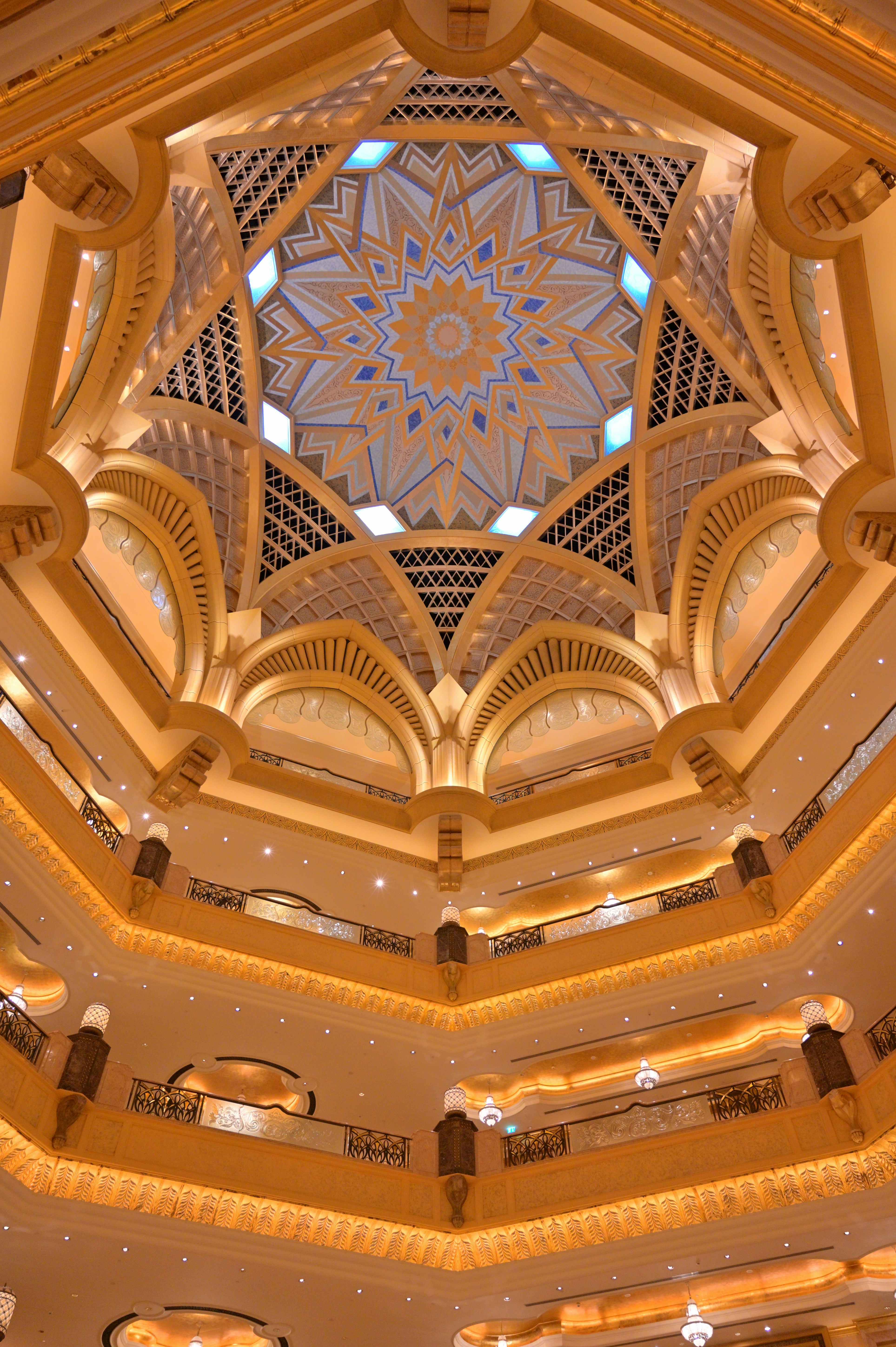 Ornate golden dome ceiling with intricate geometric patterns.