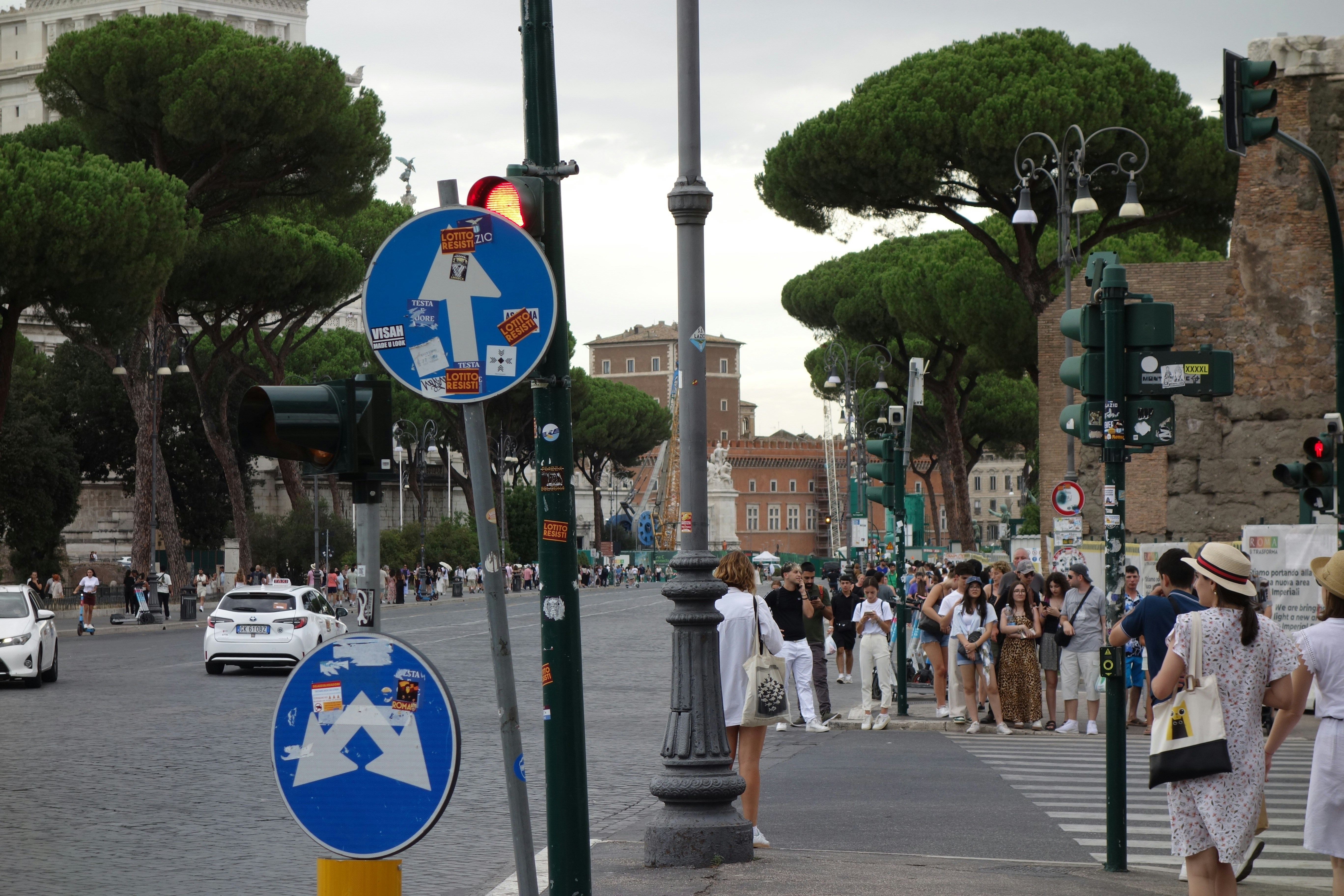 Street scene with people and traffic signs