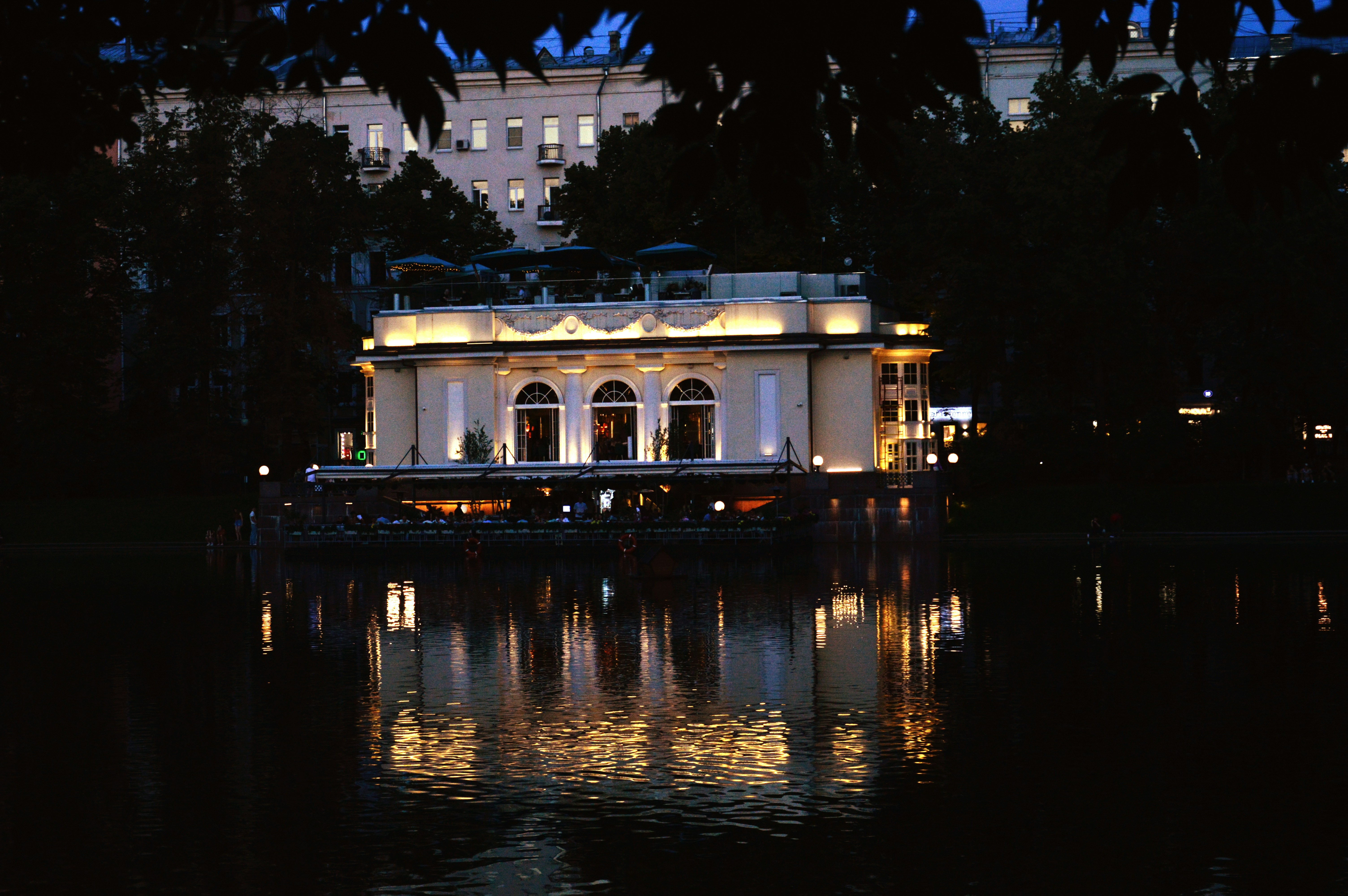 Building reflected in water at night