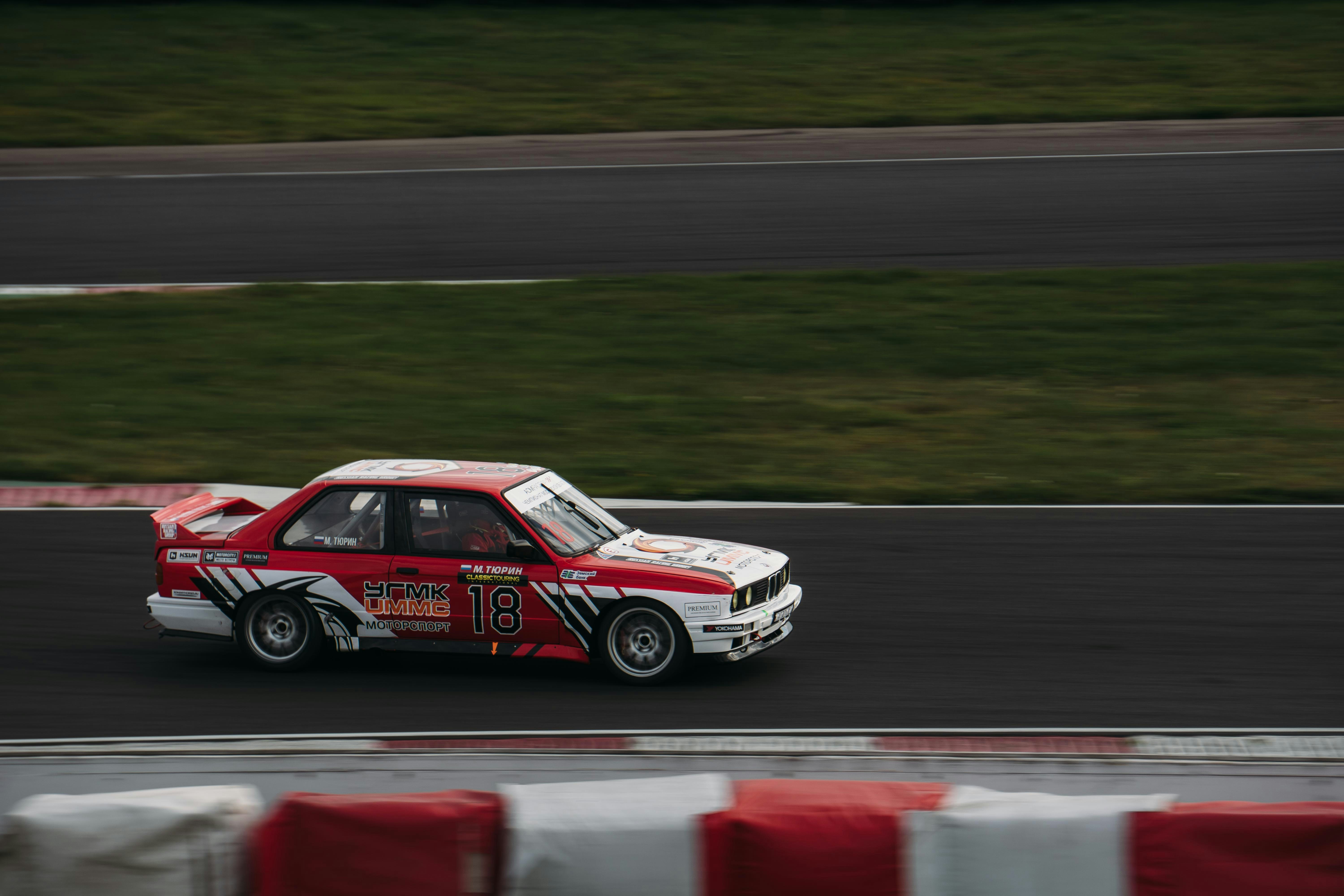 Red and white race car on a track