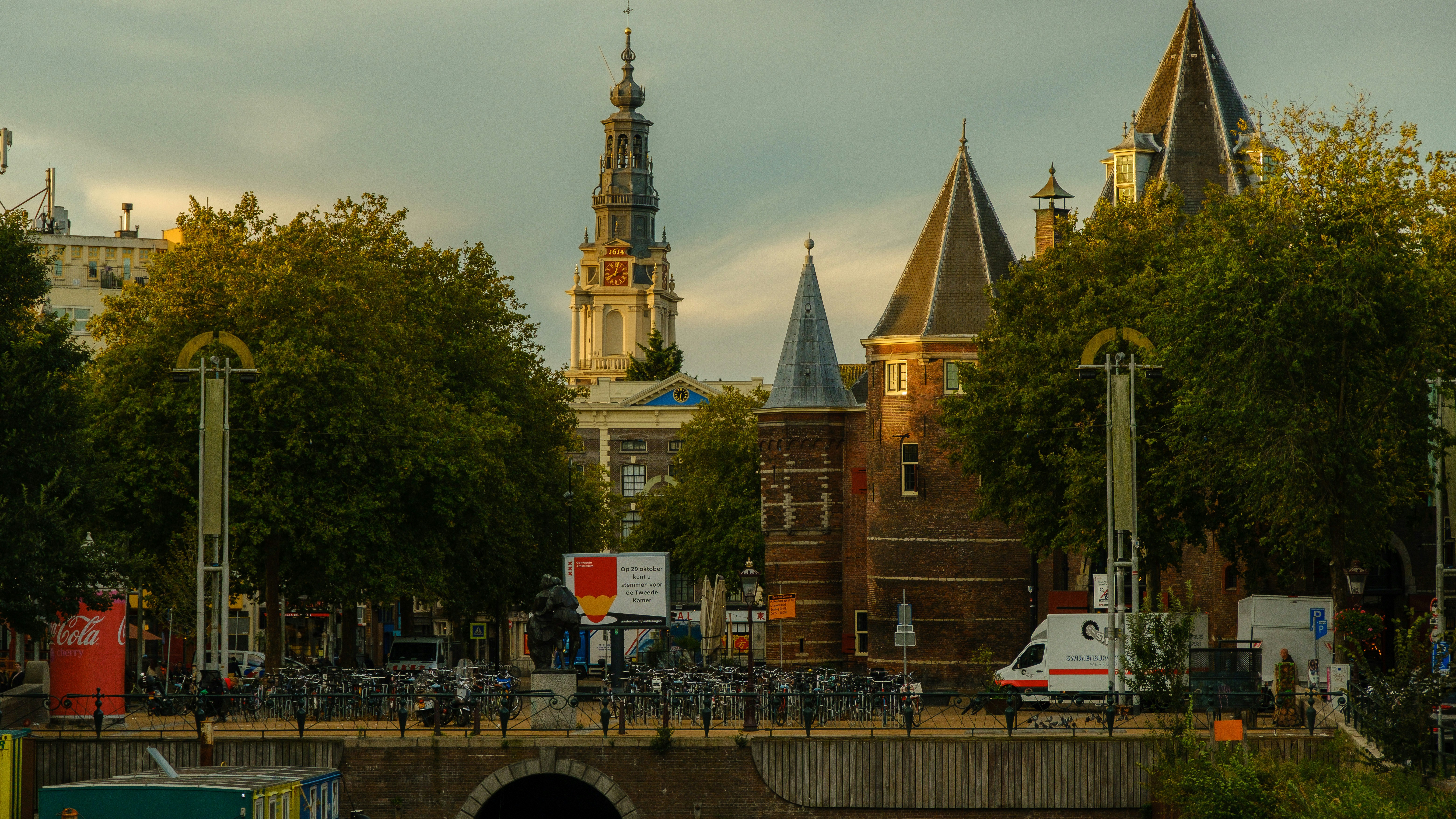 Historic buildings and trees by a canal