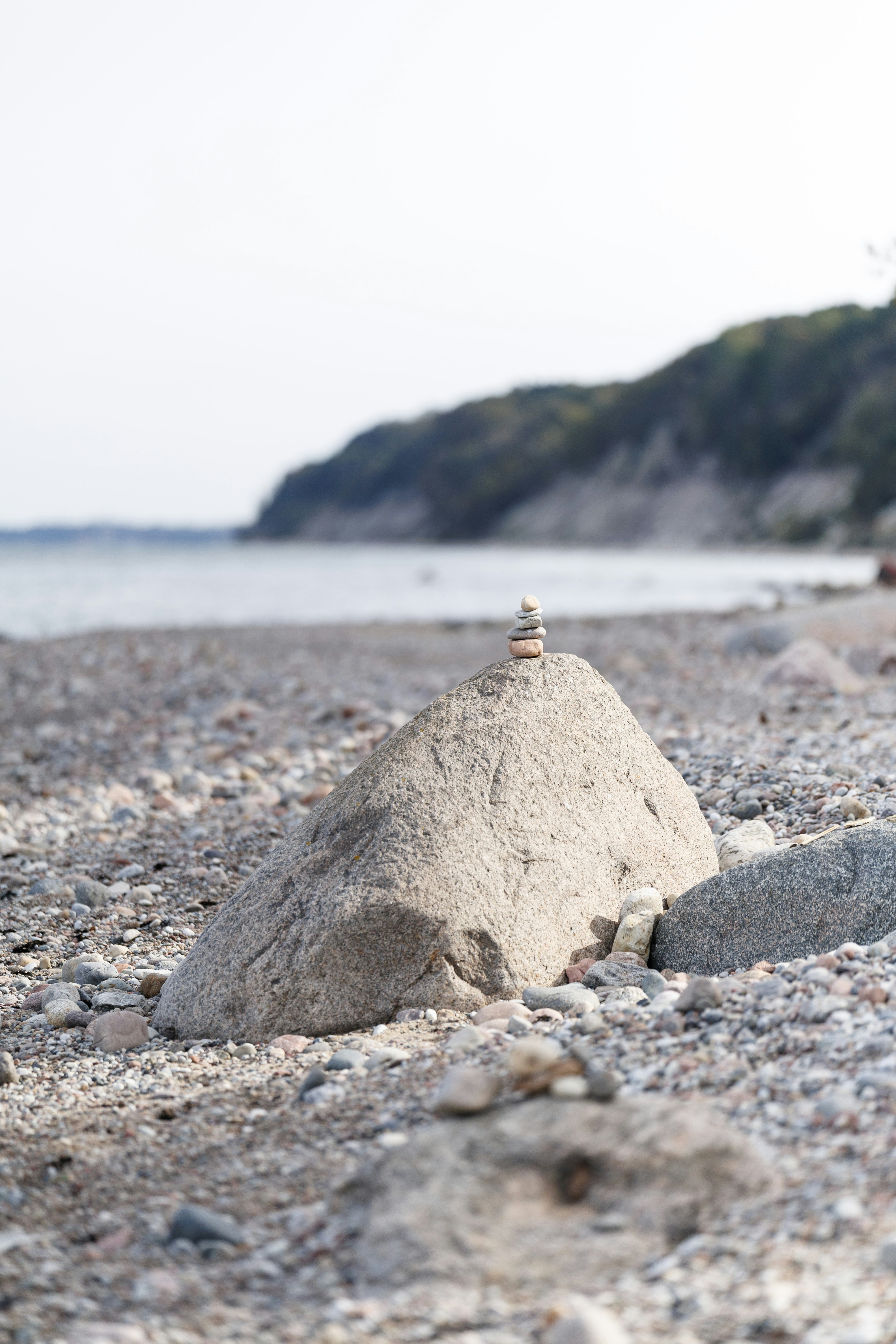 Nature's Balancing Act: A Stone Tower on the Shore