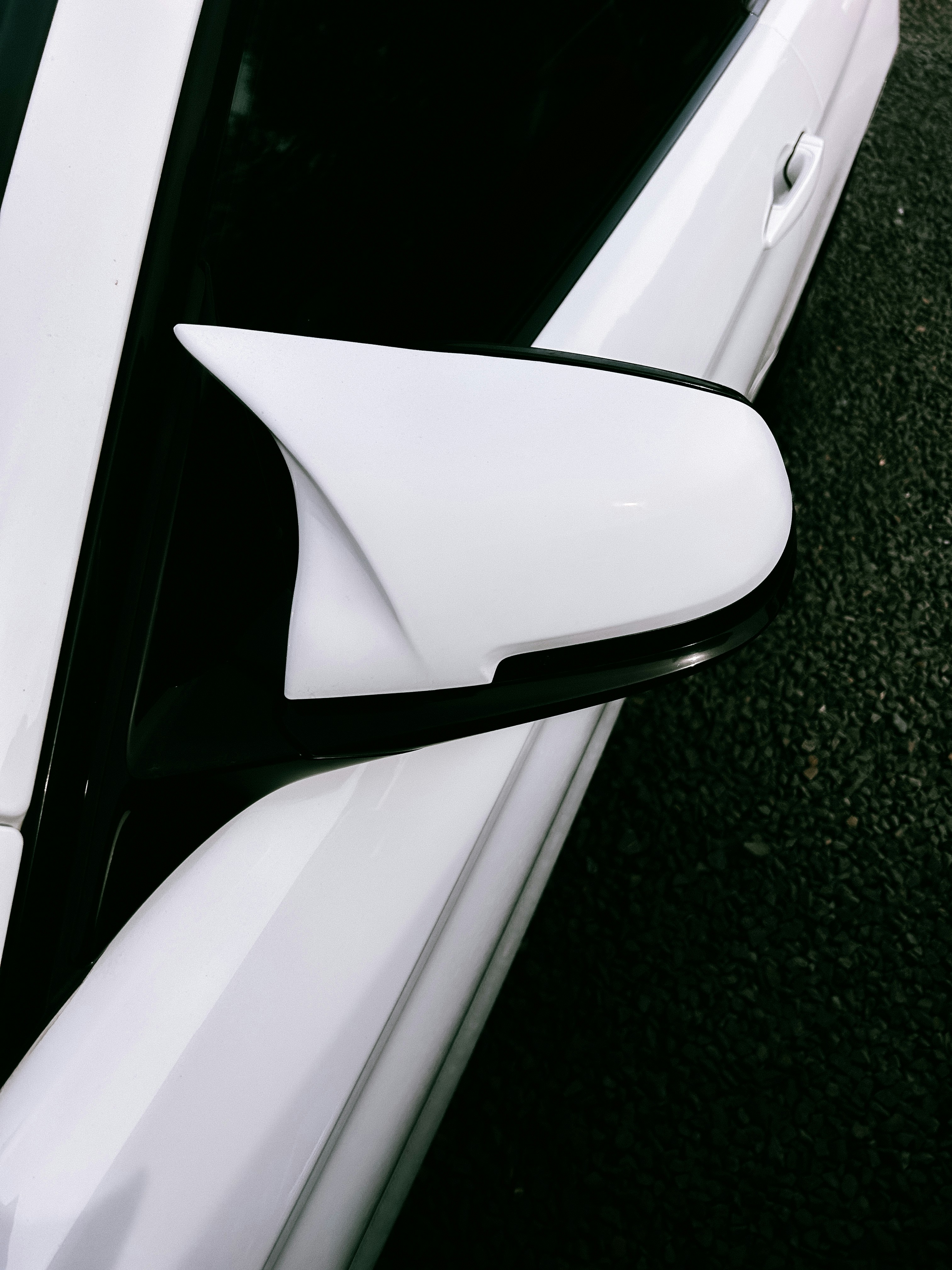 White car side mirror and door detail